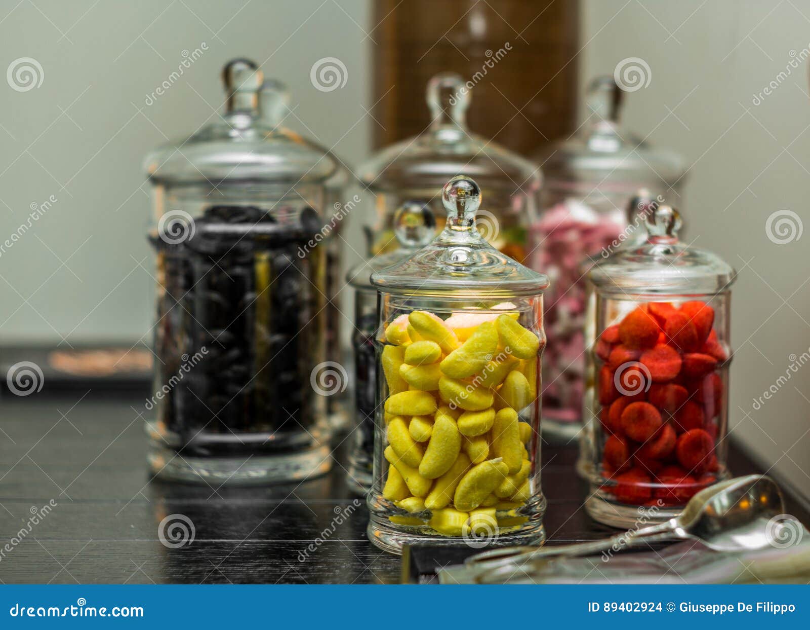 Sweets in glass jars stock photo. Image of colorful, sweets - 89402924