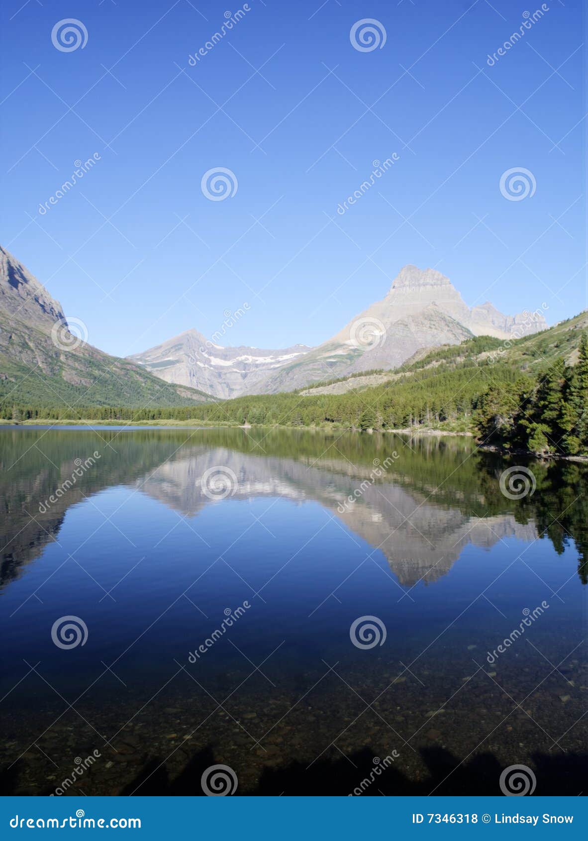 Swiftcurrentl Lake stock photo. Image of mountains, calm - 7346318