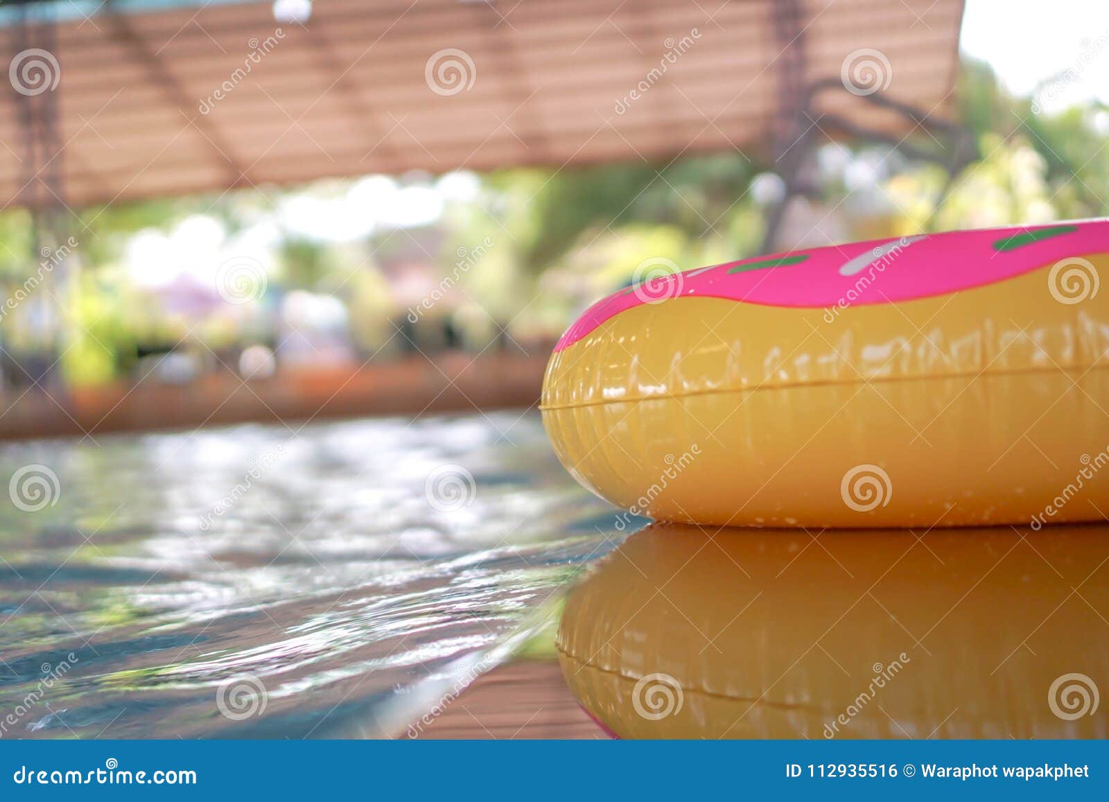 Swim Ring Floating on Blue Water with an Airy Wave Reflection. Stock ...