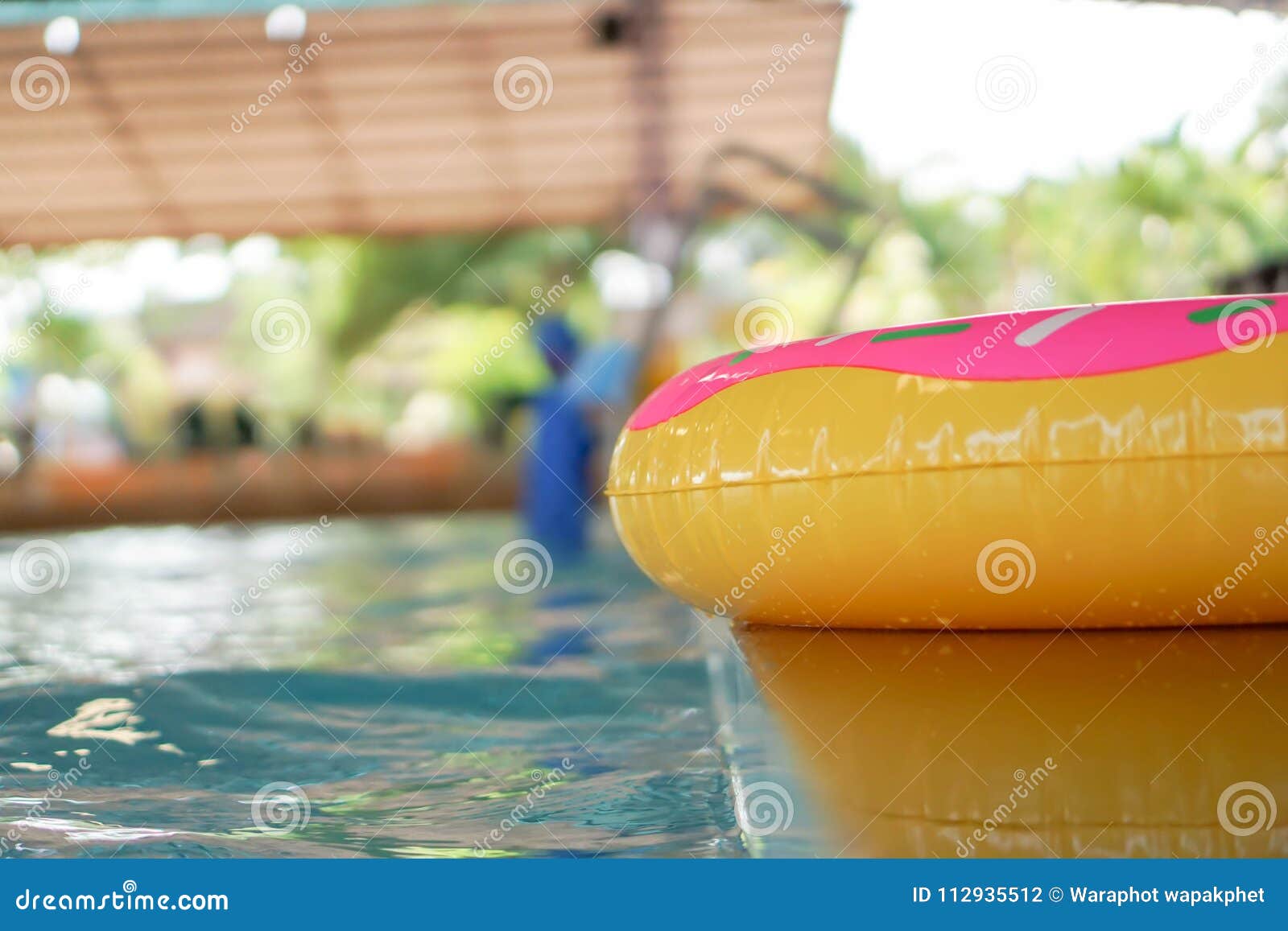 Swim Ring Floating on Blue Water with an Airy Wave Reflection. Stock ...