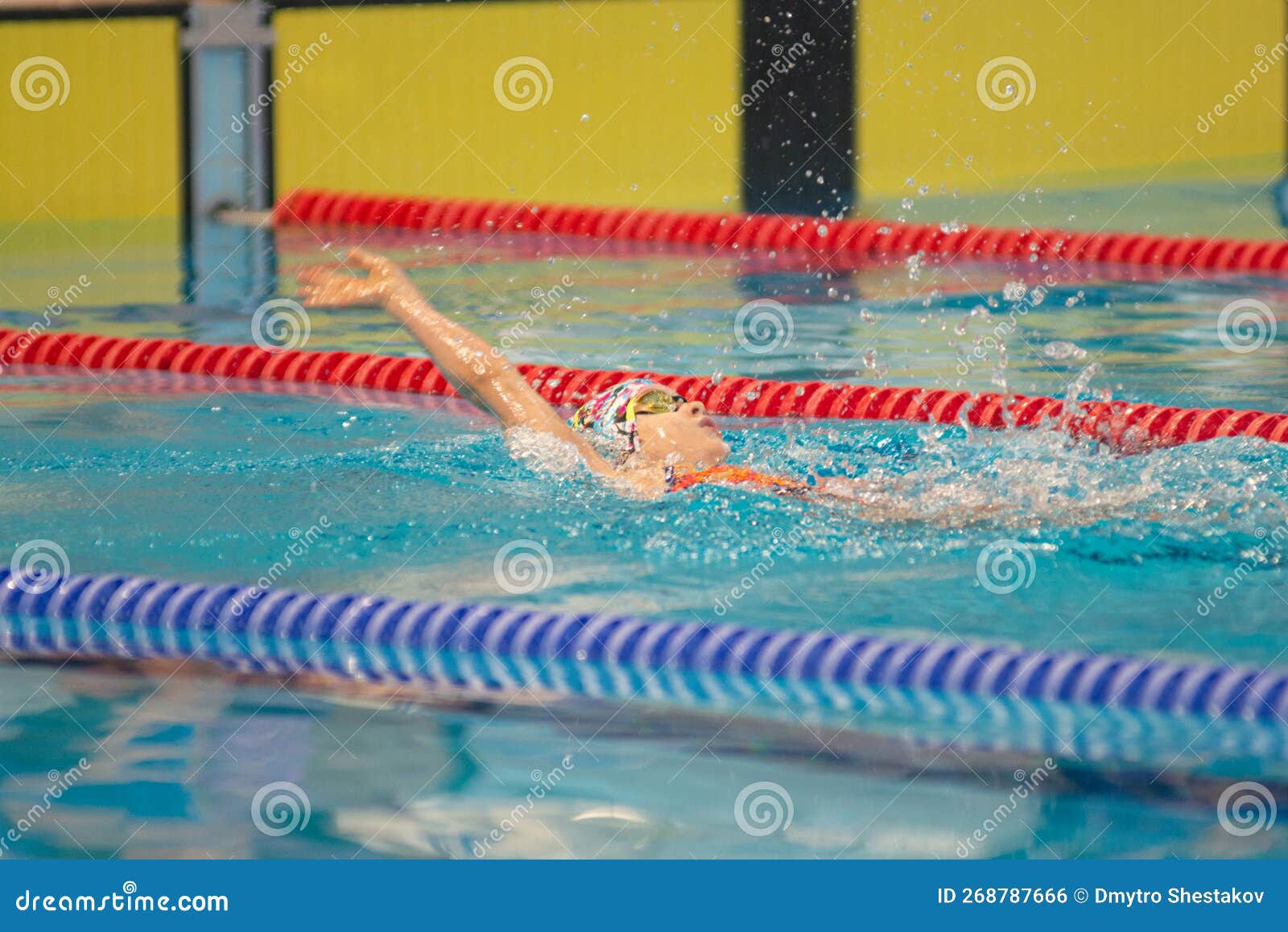Swimmer Child Swims Backstroke Swimming Style in the Pool Stock Photo ...