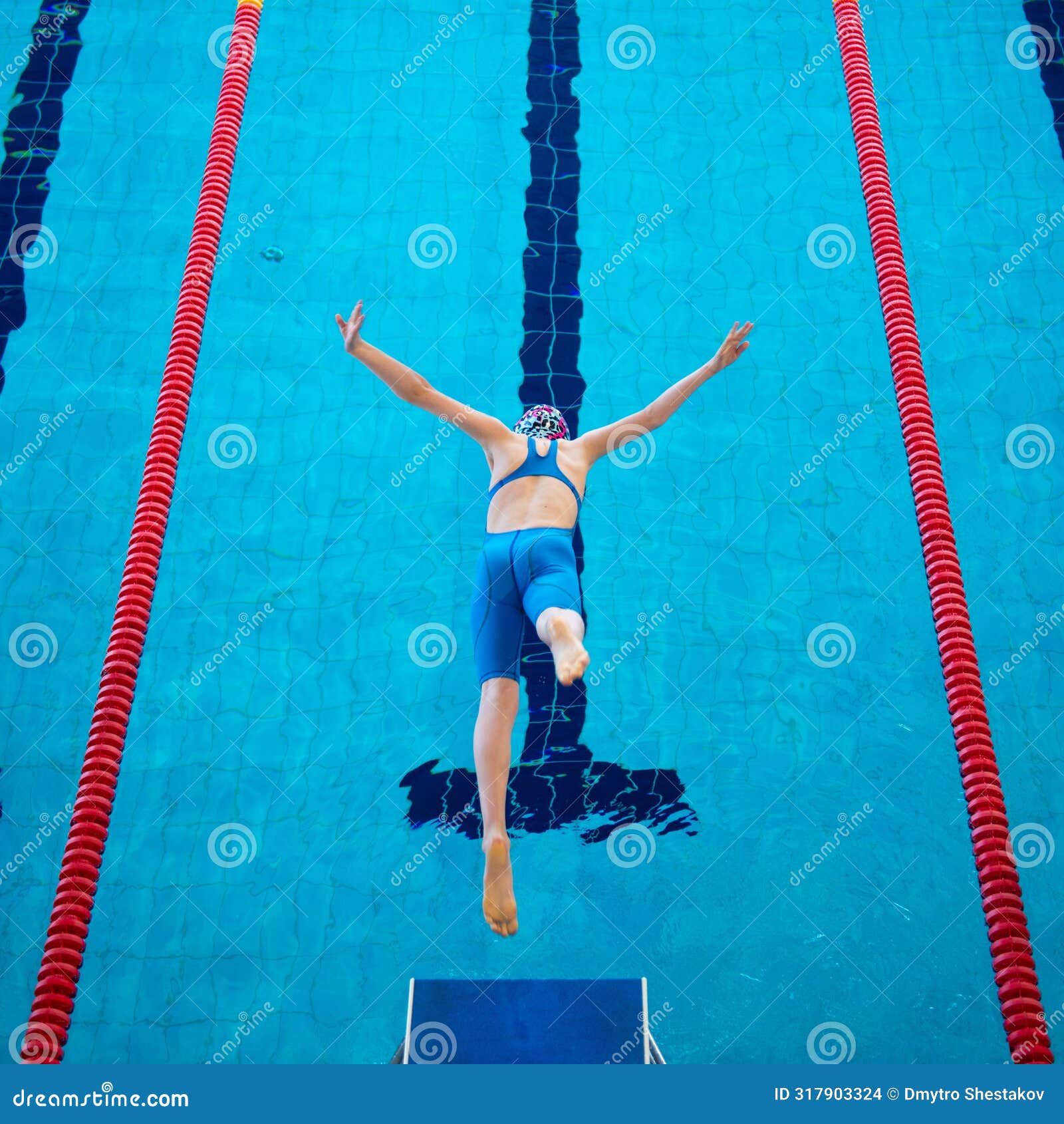Swimmer Girl Start from the Starting Table in the Pool Stock Photo ...