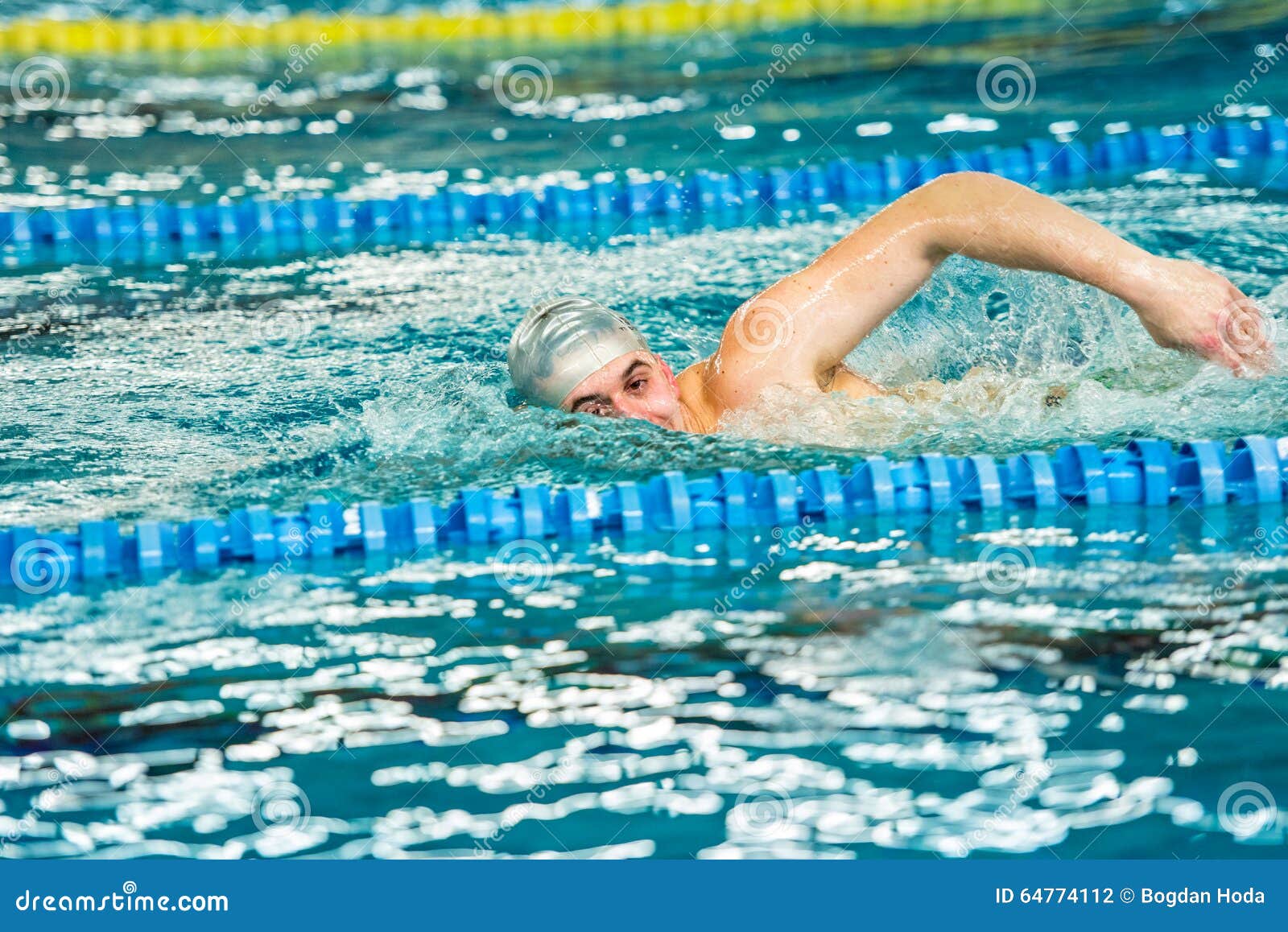 Swimmer Performing Front Crawl Freestyle Stroke in Indoor Pool. Stock ...