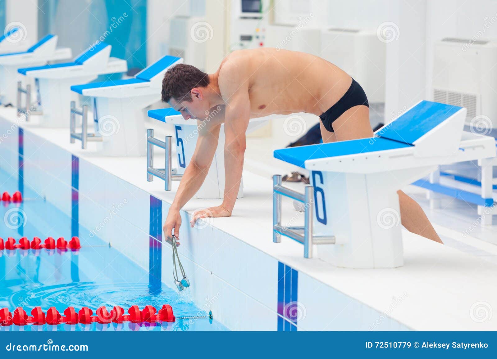 Swimmer in the Pool Getting Ready To Start, Washes Glasses Water Stock ...