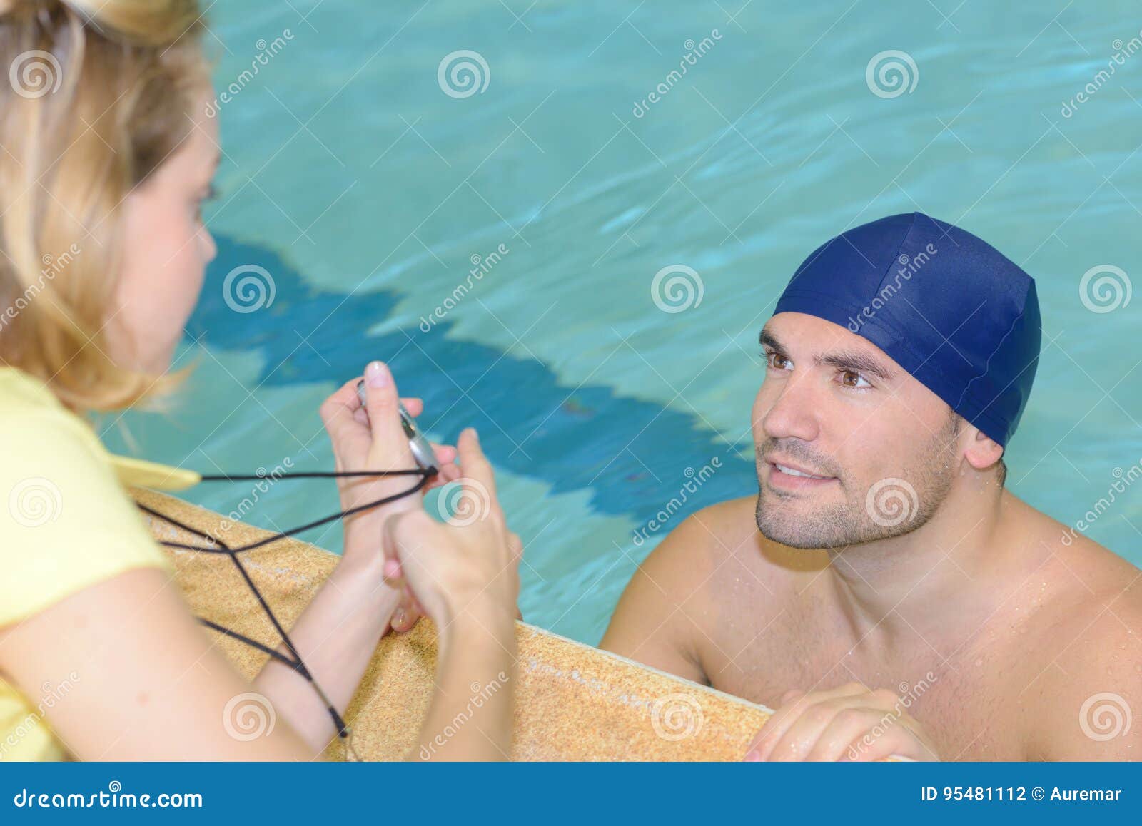 Swimmer Talking To Coach by Poolside at Leisure Center Stock Photo ...