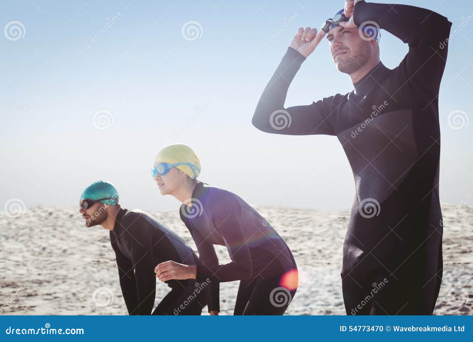 Swimmers Getting Ready at the Beach Stock Photo - Image of three, ocean ...