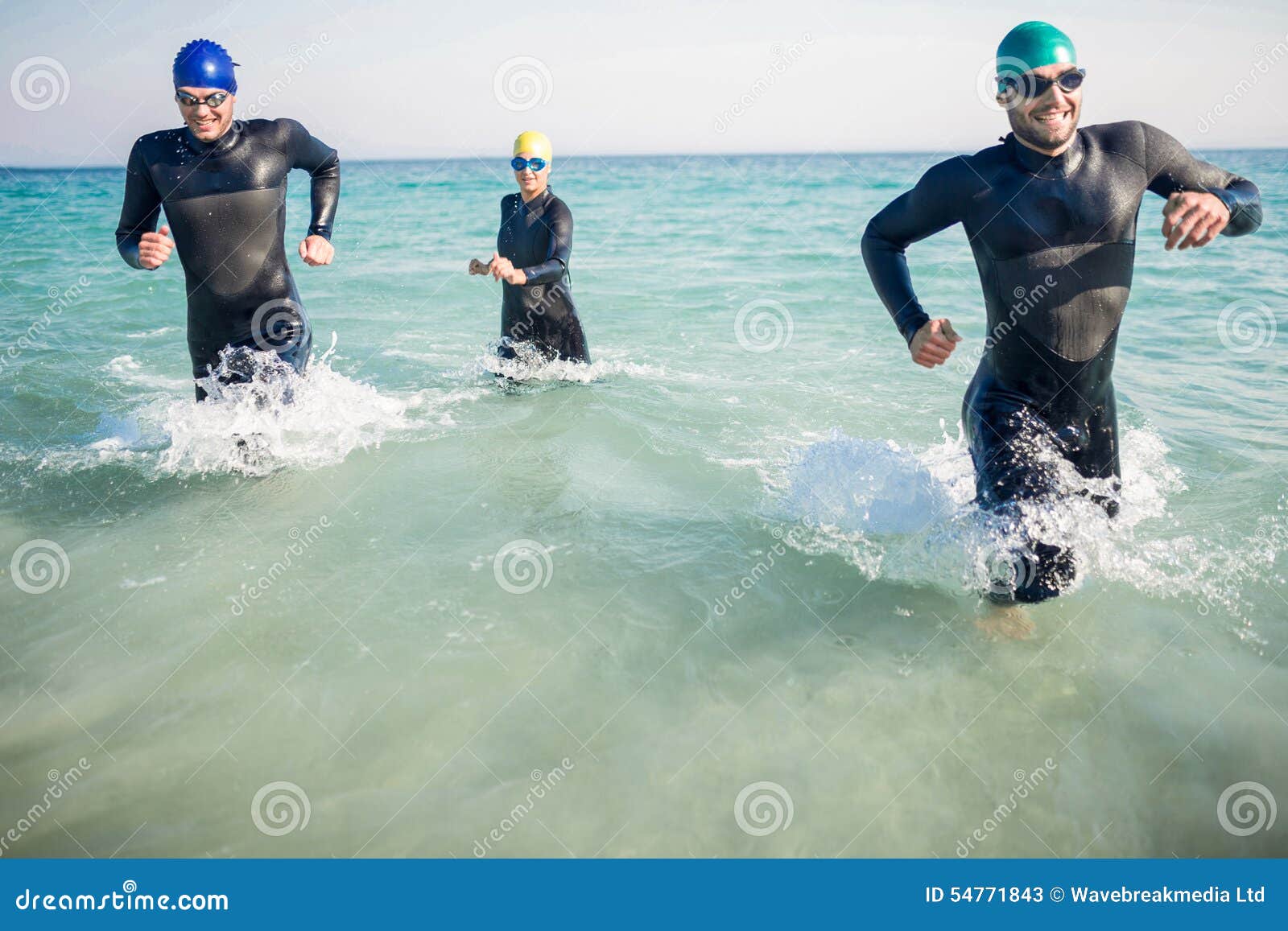 Swimmers Running in the Ocean Stock Image - Image of swimwear, male ...
