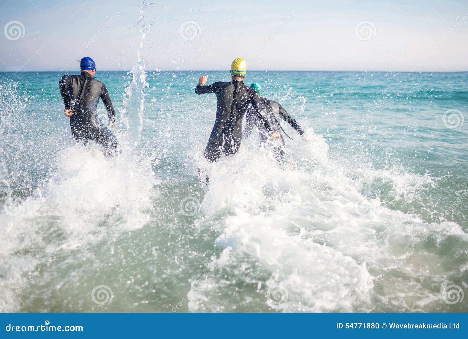 Swimmers Running in the Ocean Stock Photo - Image of swimming, vacation ...