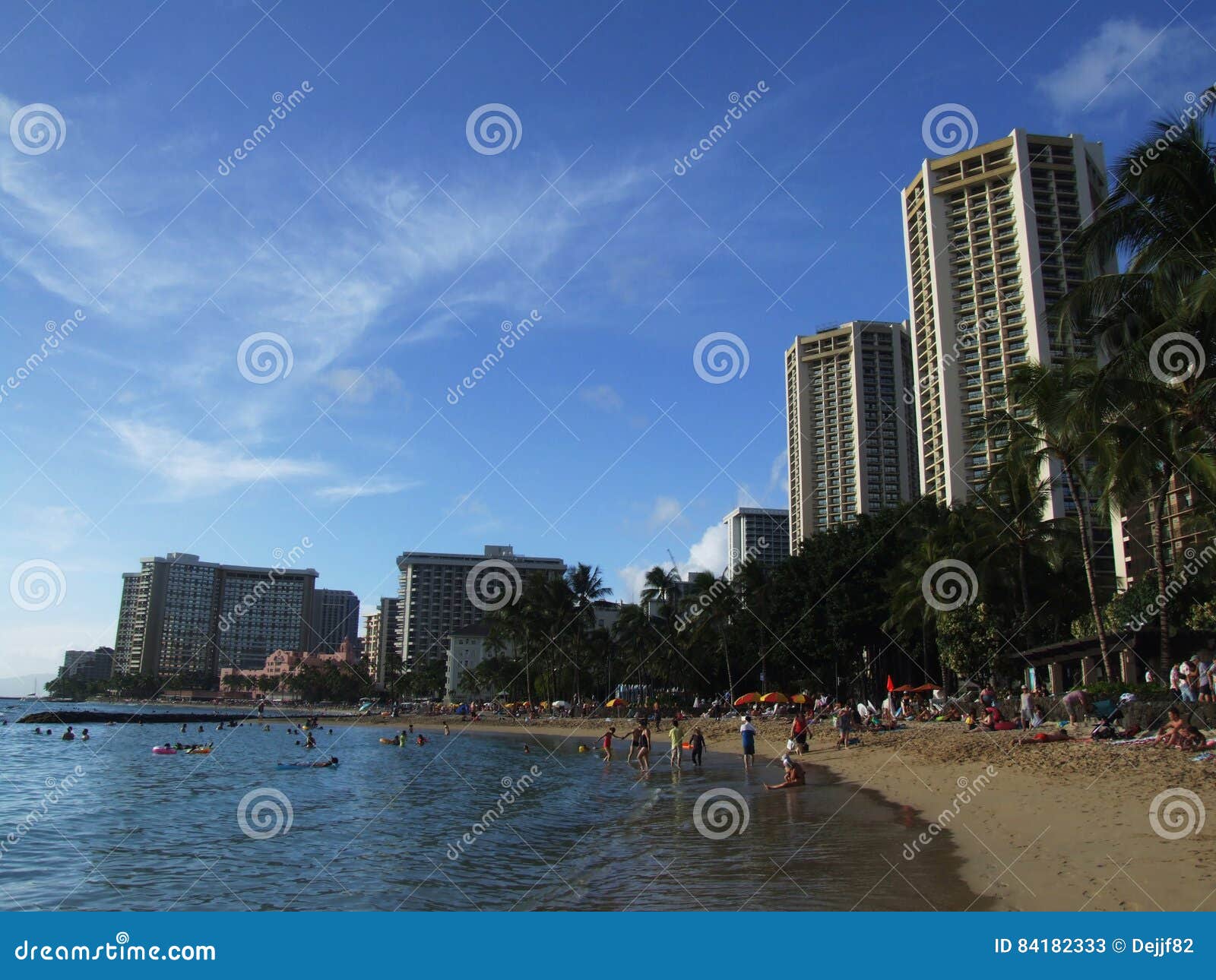 Swimmers at Waikiki Beach editorial stock photo. Image of sand - 84182333