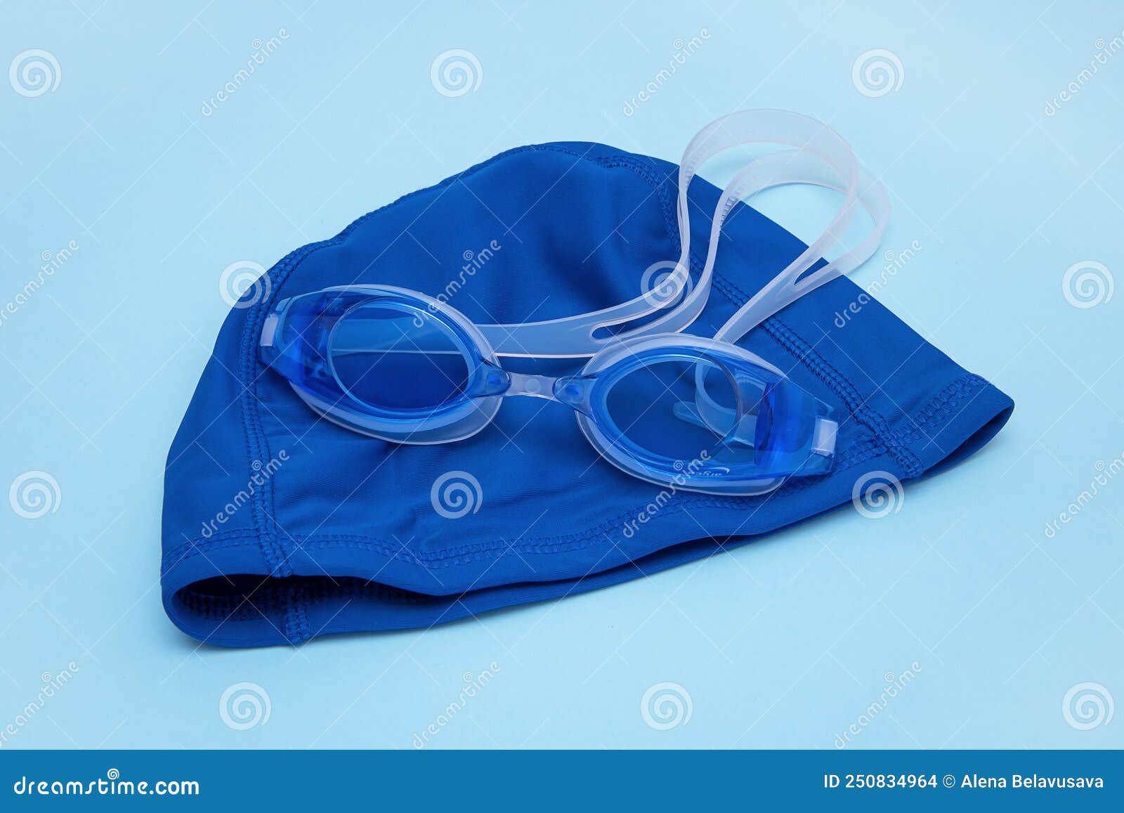 Swimming Cap, Goggles on a Blue Background. Stock Photo - Image of girl ...