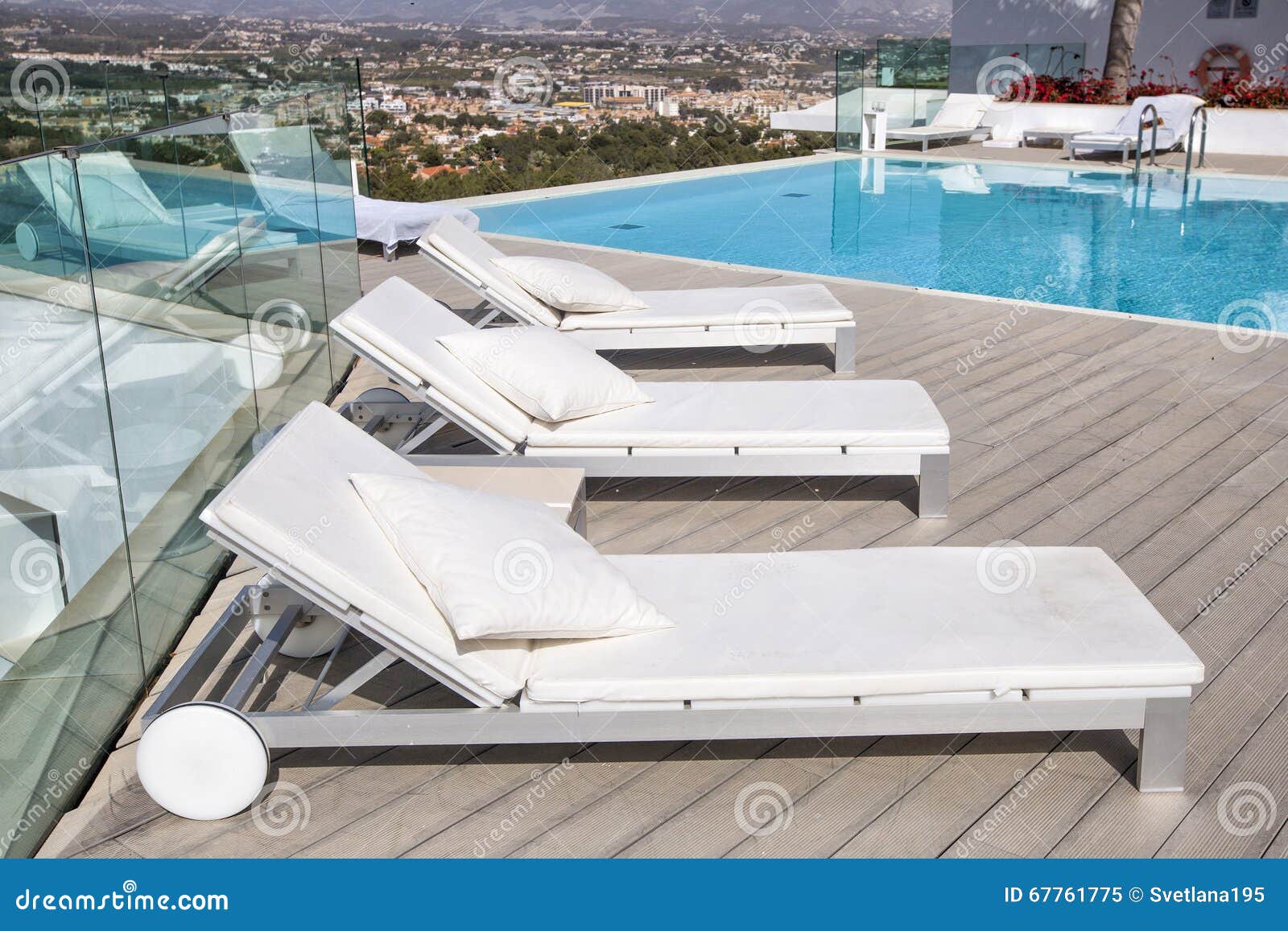 Swimming Pool Area with White Sun Beds at the Modern Resort. Stock ...