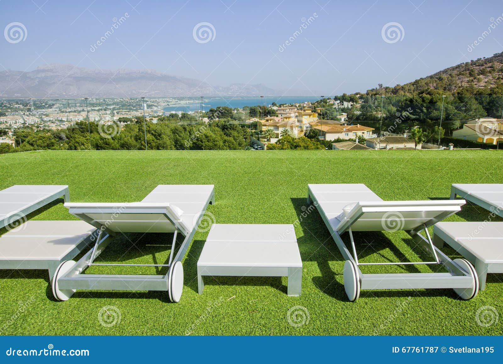 Swimming Pool Area with White Sun Beds at the Modern Resort. Stock ...