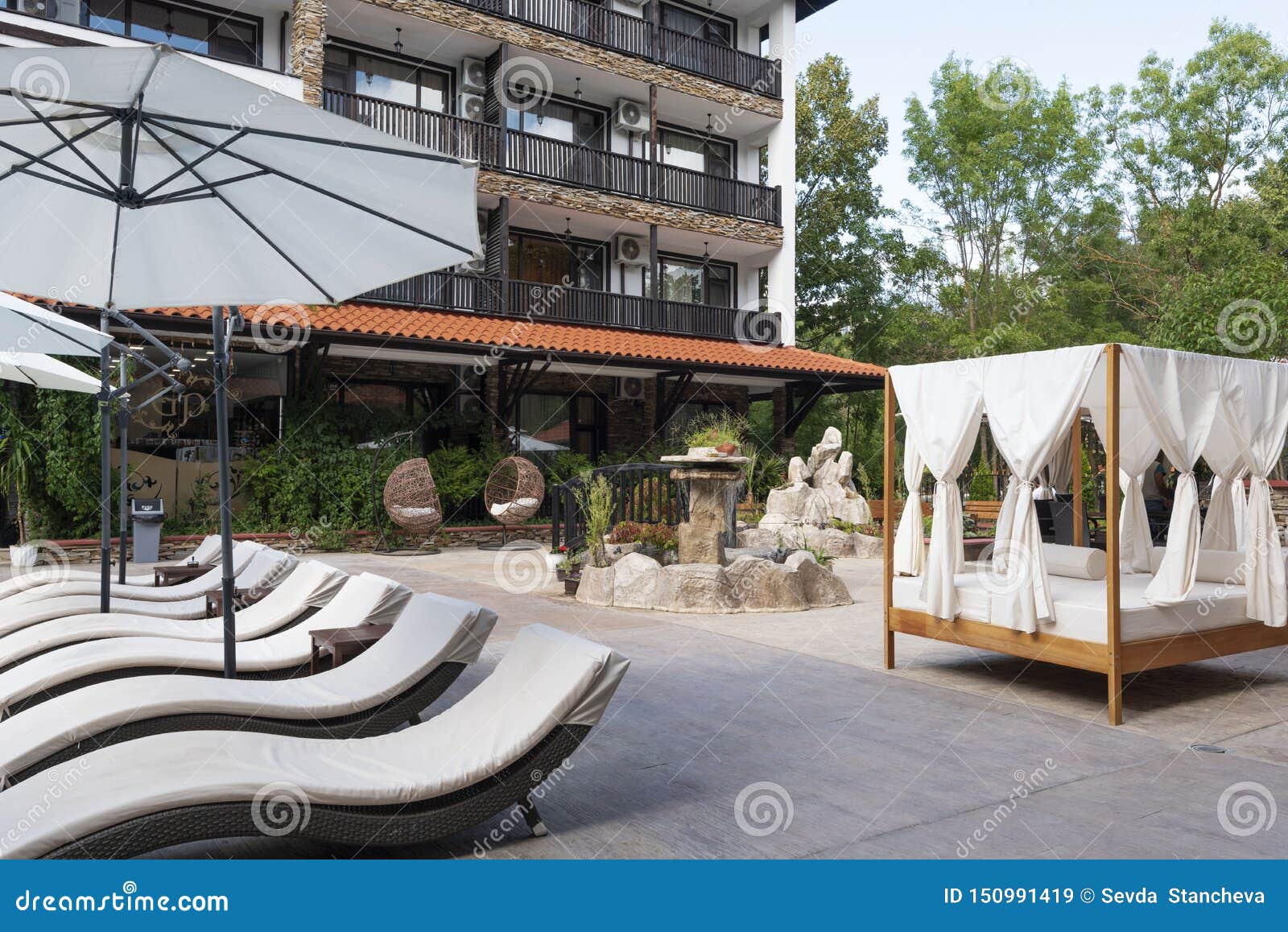 Swimming Pool Area with White Sun Beds. Summer Vacation Stock Image ...