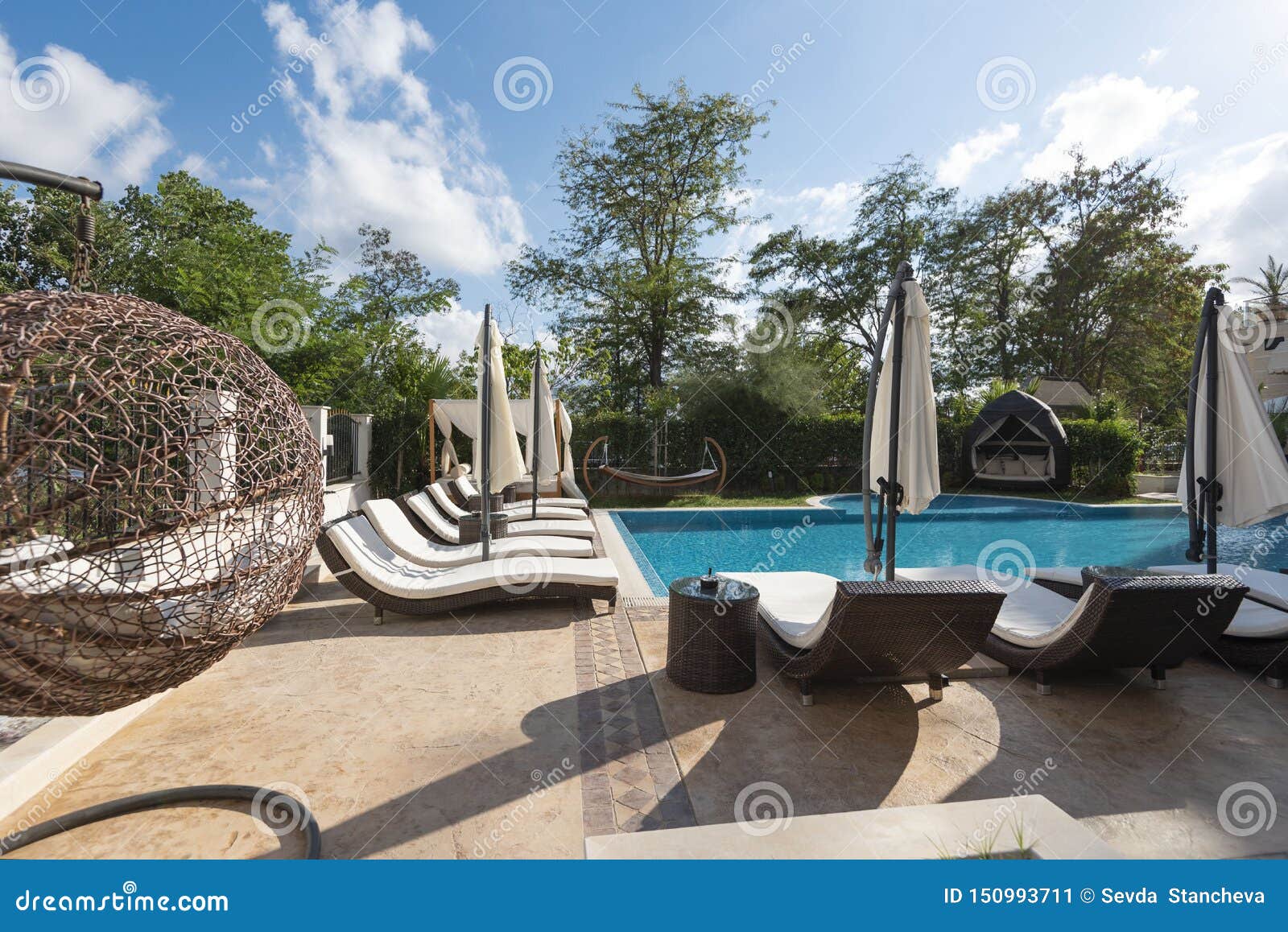 Swimming Pool Area with White Sun Beds. Summer Vacation Stock Image ...