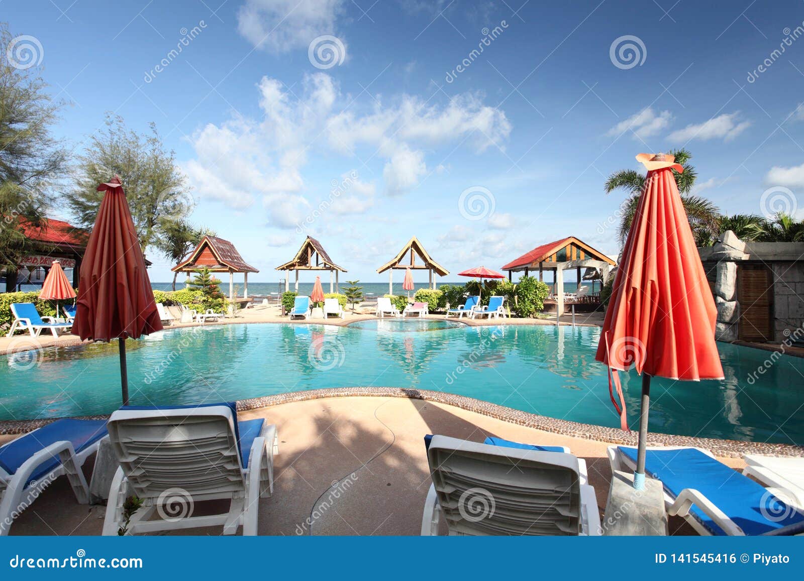 Swimming pool and beach stock photo. Image of relaxation - 141545416
