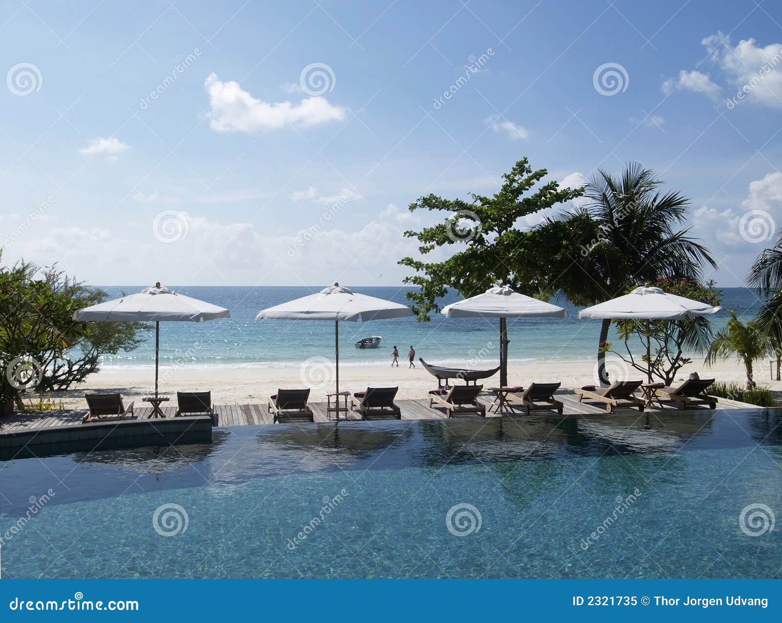 Swimming-pool and beach stock image. Image of parasol - 2321735