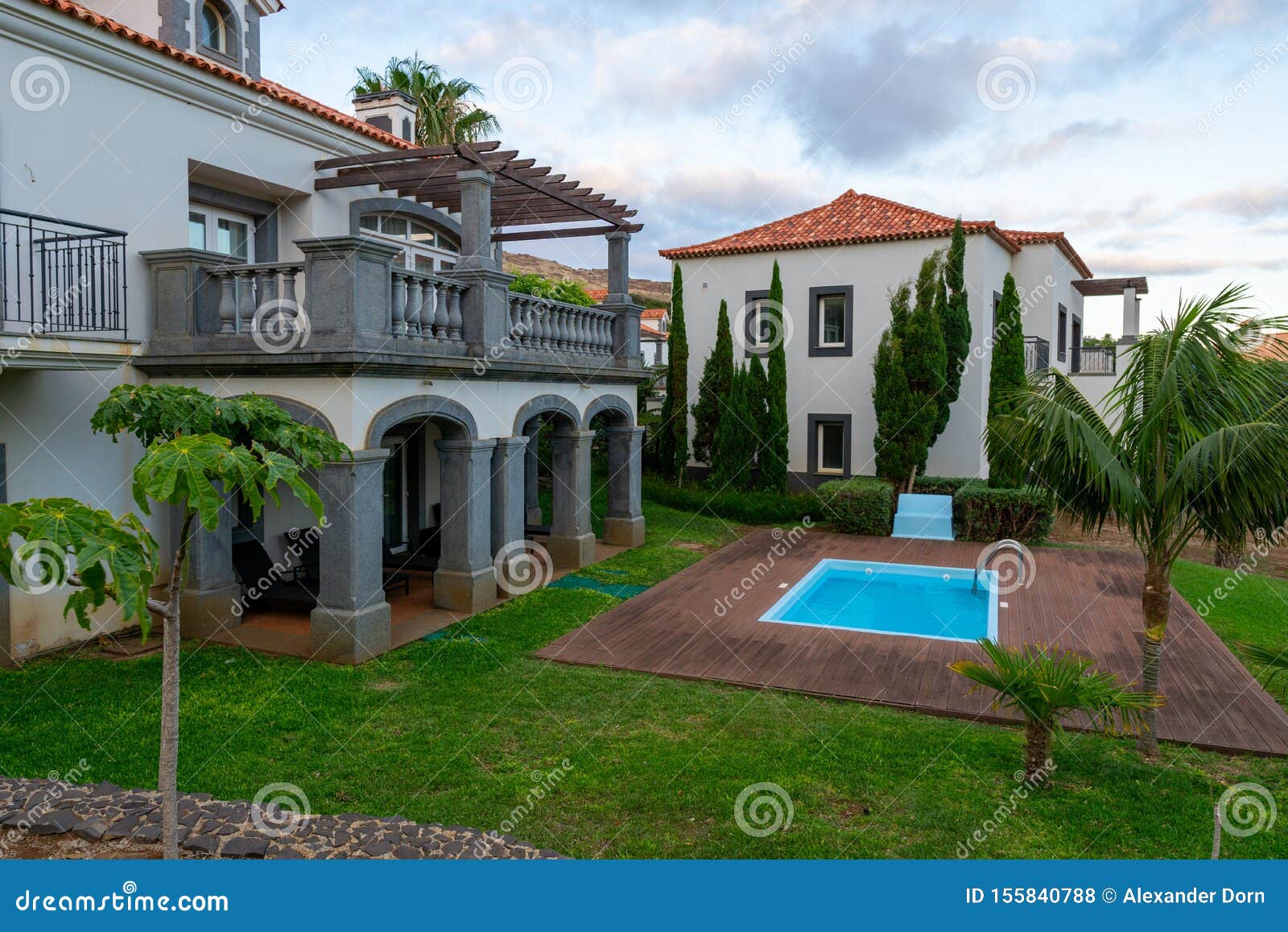 Swimming Pool Design with Wood Deck and Modern Villa Stock Photo ...