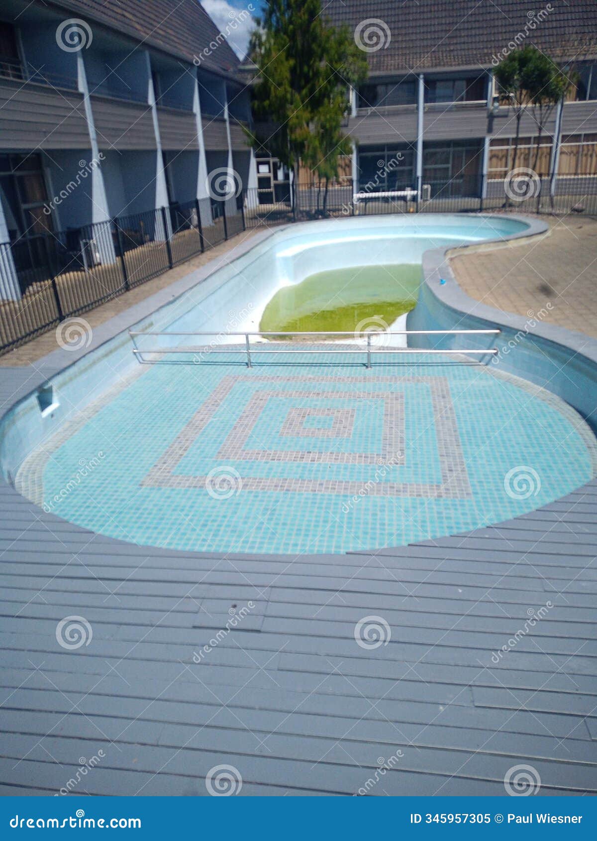 Swimming Pool Empty Due To Renovation Being Tiled in the Back of a ...
