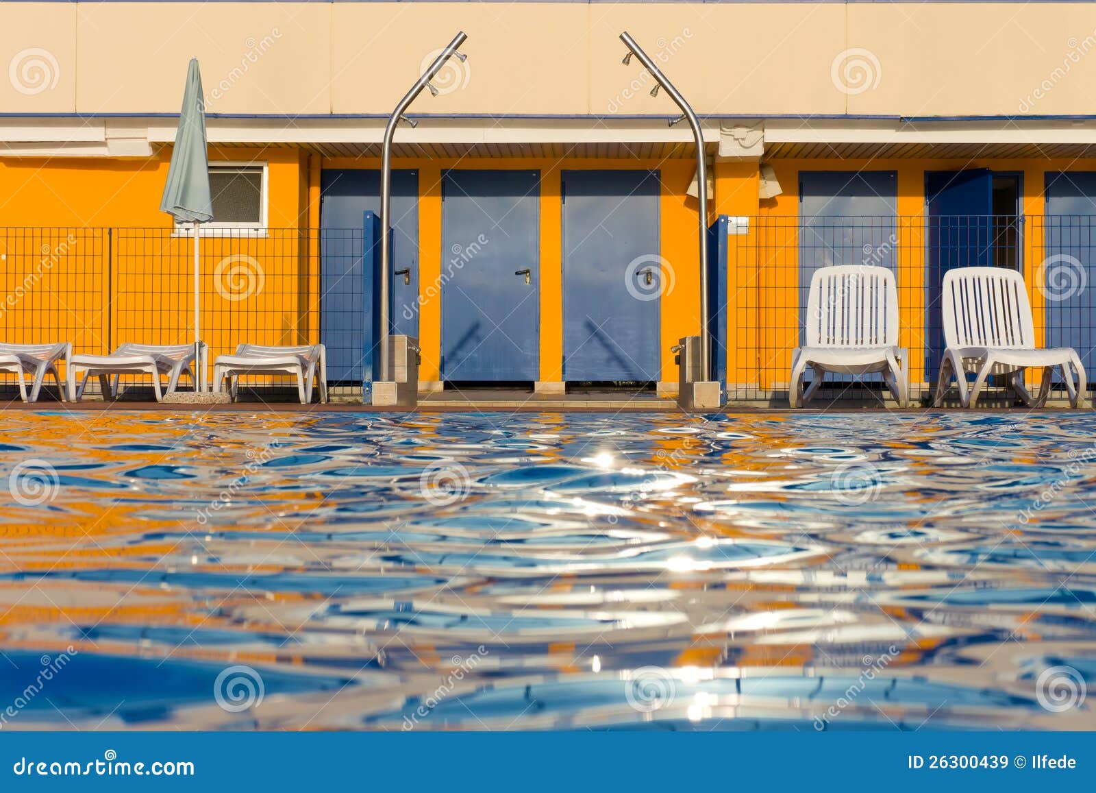 Swimming pool entrance stock image. Image of deckchairs - 26300439