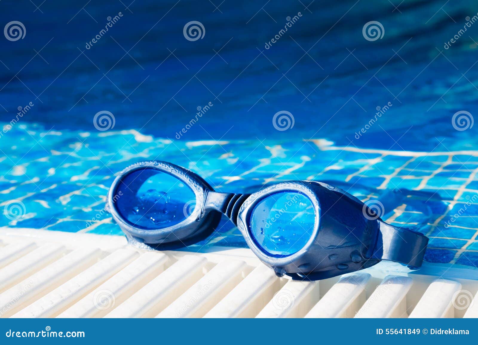 Swimming Pool Goggles on the Poolside Stock Image - Image of active ...
