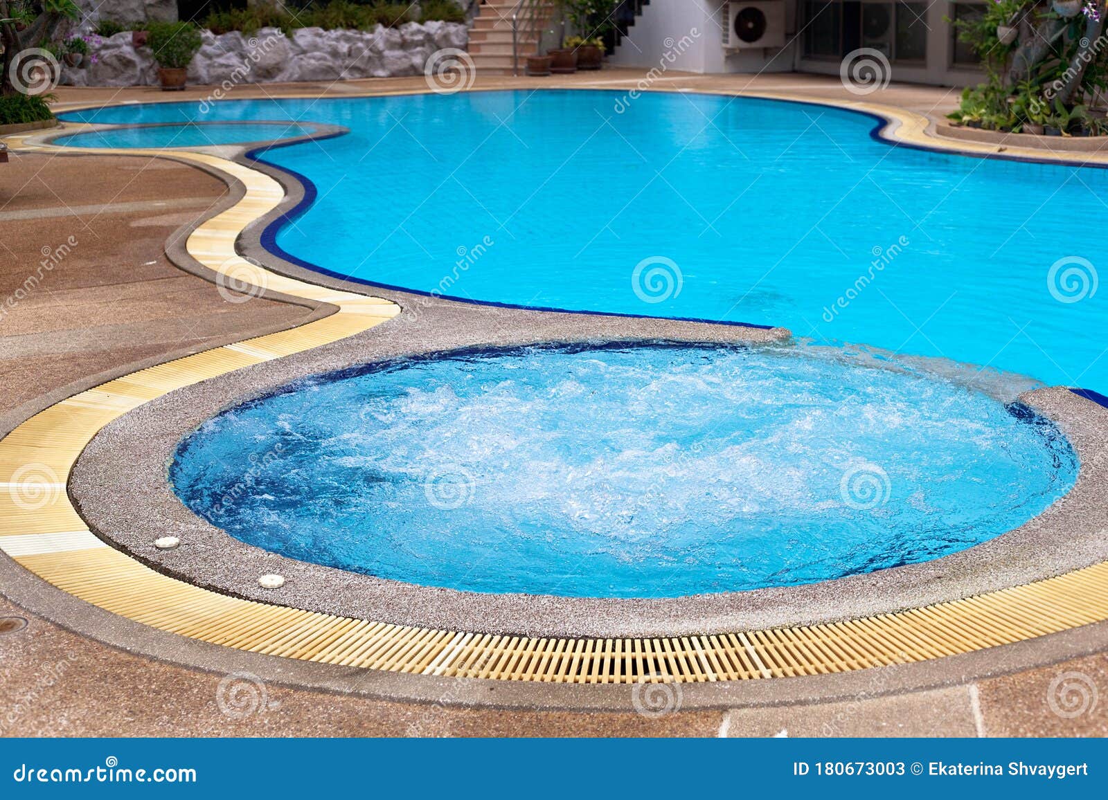 Swimming pool with jacuzzi stock image. Image of holiday - 180673003