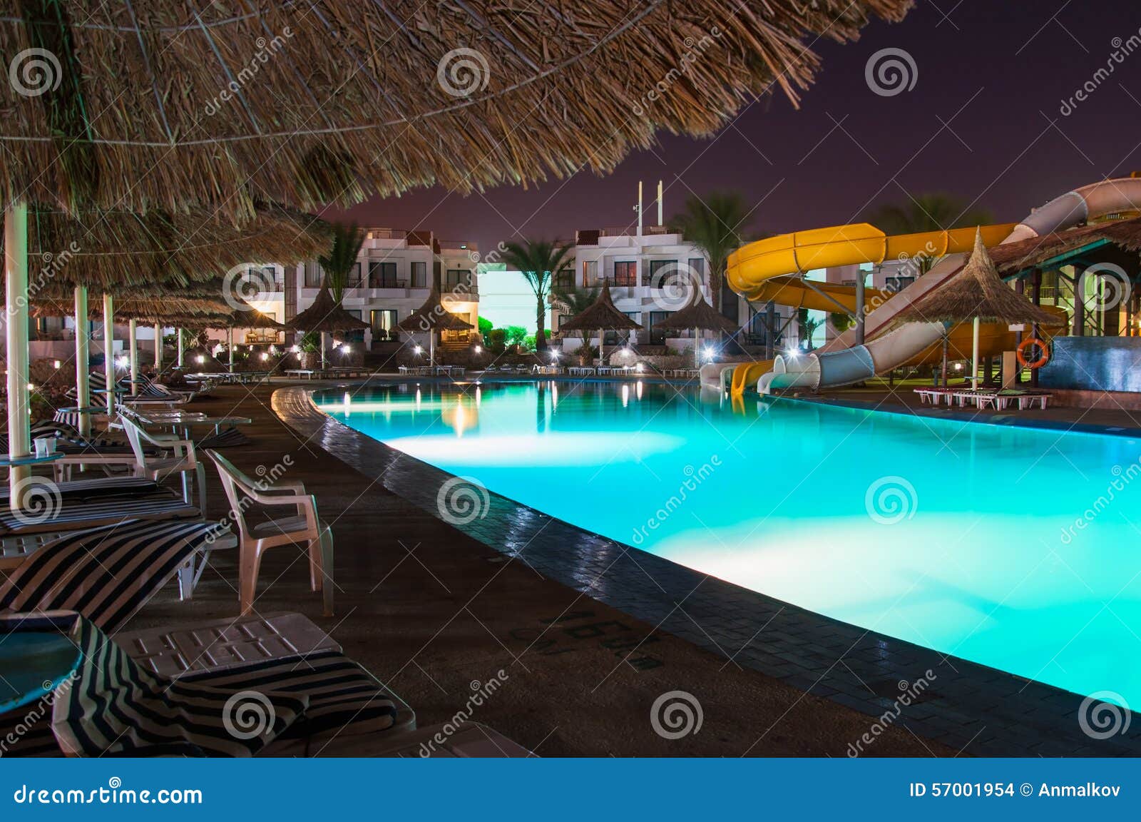 Swimming Pool at Luxury Resort at Night Stock Photo - Image of palm ...