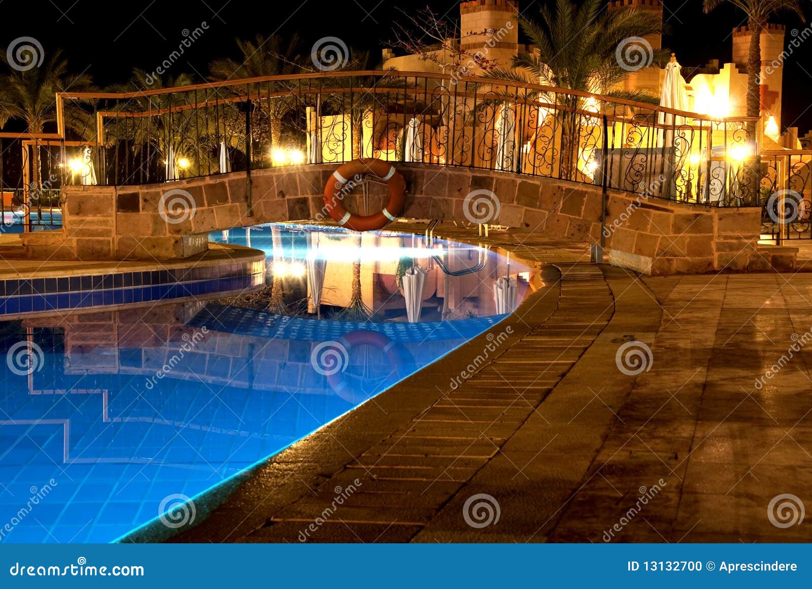 Swimming pool by night stock photo. Image of luxurious - 13132700