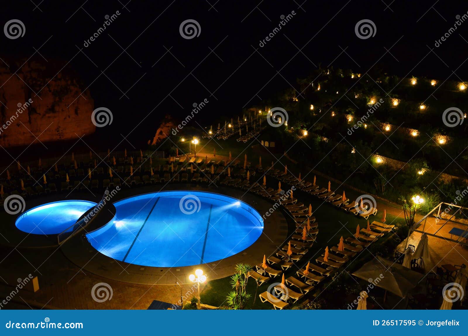 Swimming pool at night stock image. Image of night, umbrella - 26517595