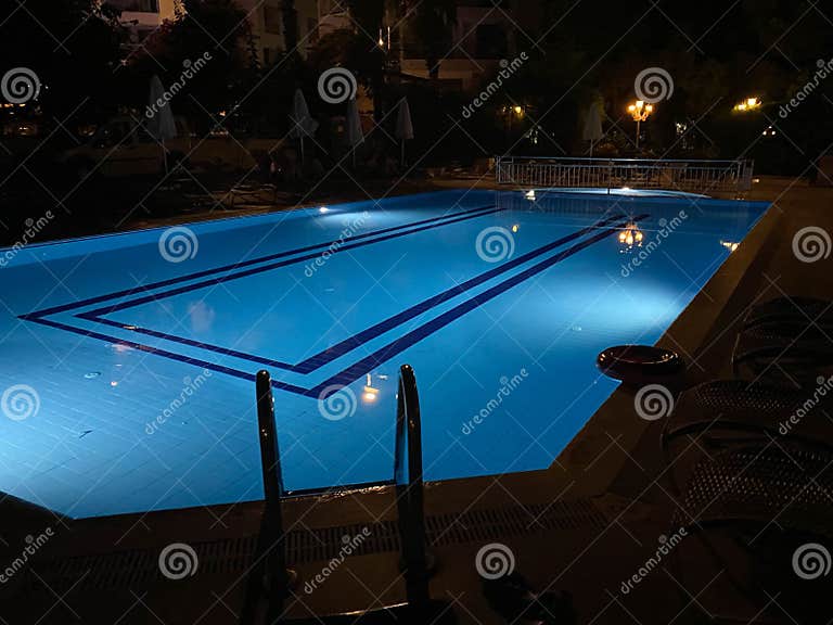 Swimming Pool at Night Time Stock Photo - Image of chair, design: 237515578