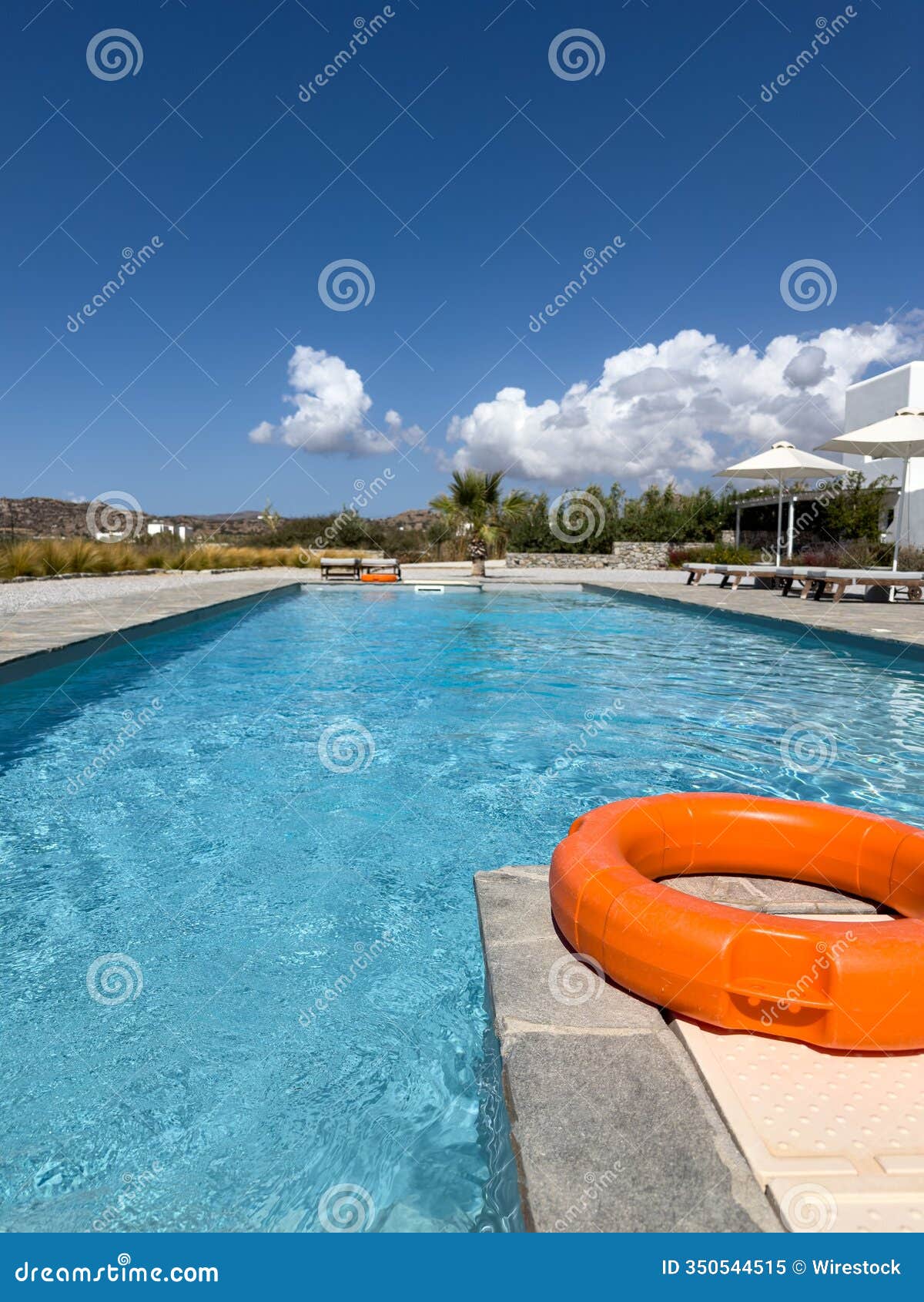 A Swimming Pool with an Orange Lifebuoy Stock Image - Image of ocean ...