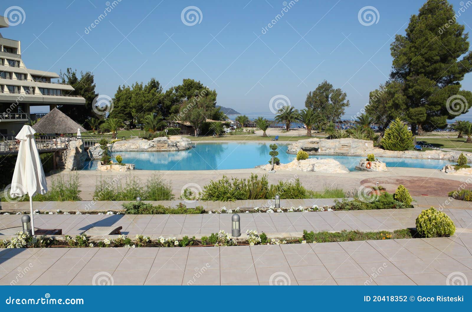 Swimming pool with park stock photo. Image of green, sithonia - 20418352