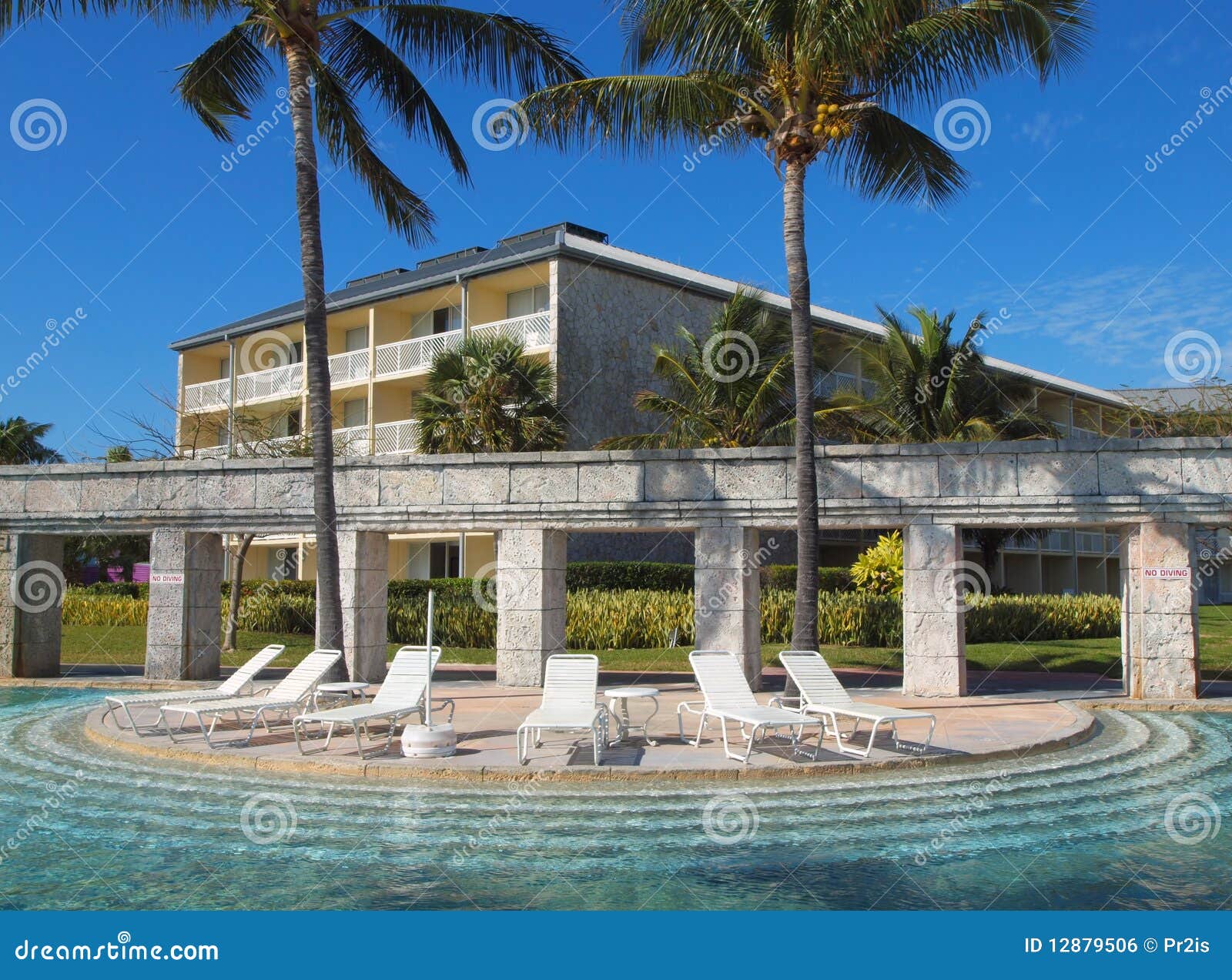 Swimming pool in a resort stock photo. Image of tourism - 12879506