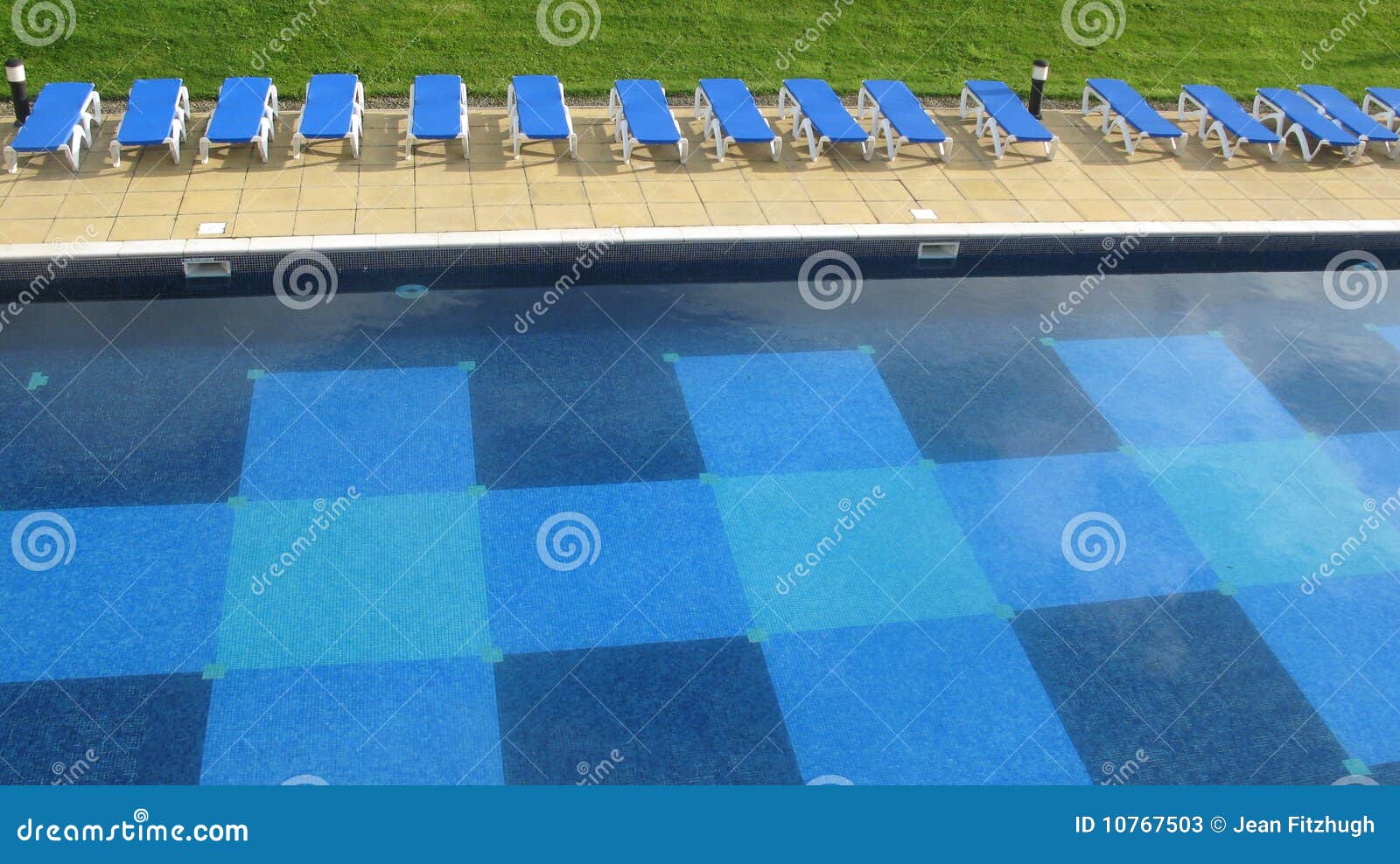 Swimming Pool and Row of Deck Chairs Stock Image - Image of chairs ...