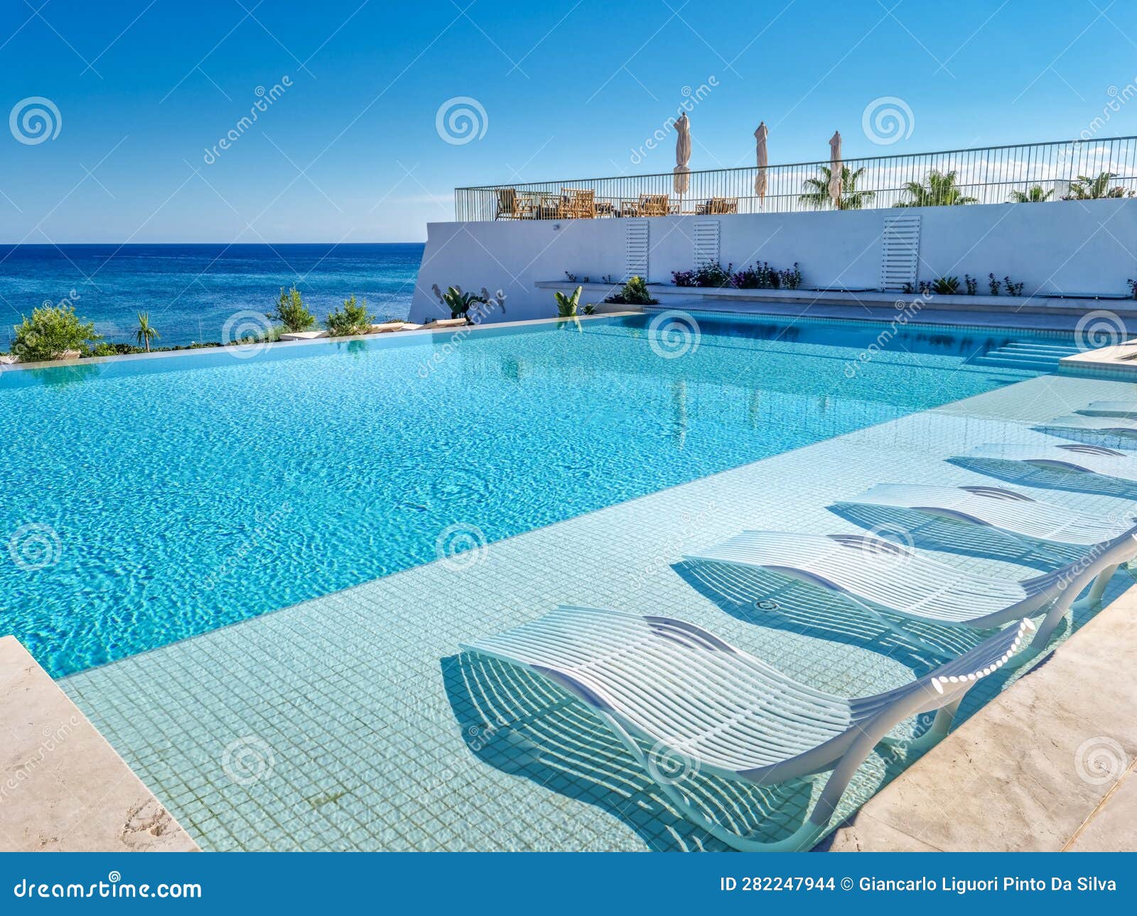 Swimming Pool with Sea View Stock Photo - Image of couple, relax: 282247944