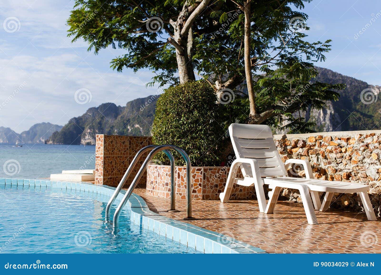 Swimming Pool with Sun Lounger Stock Image - Image of lagoon, nature ...