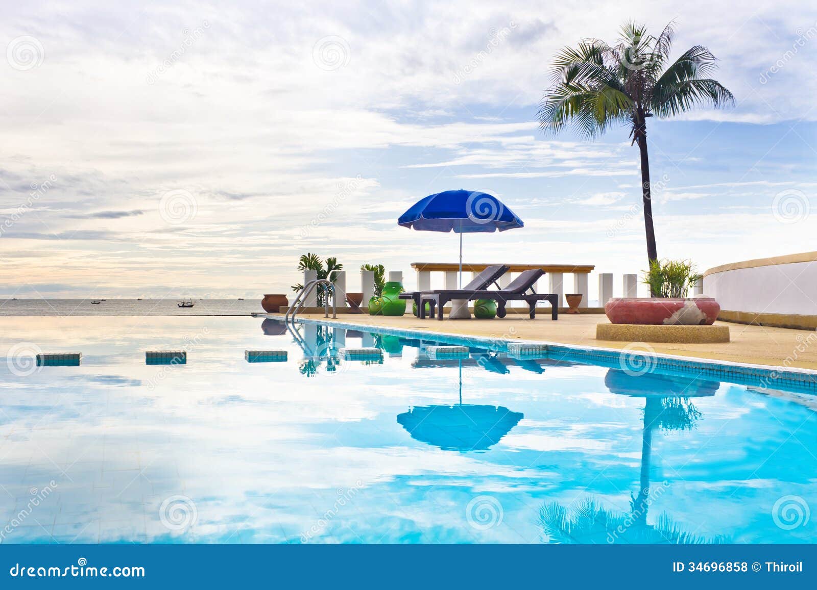 Swimming pool at sun rise. stock photo. Image of exotic - 34696858