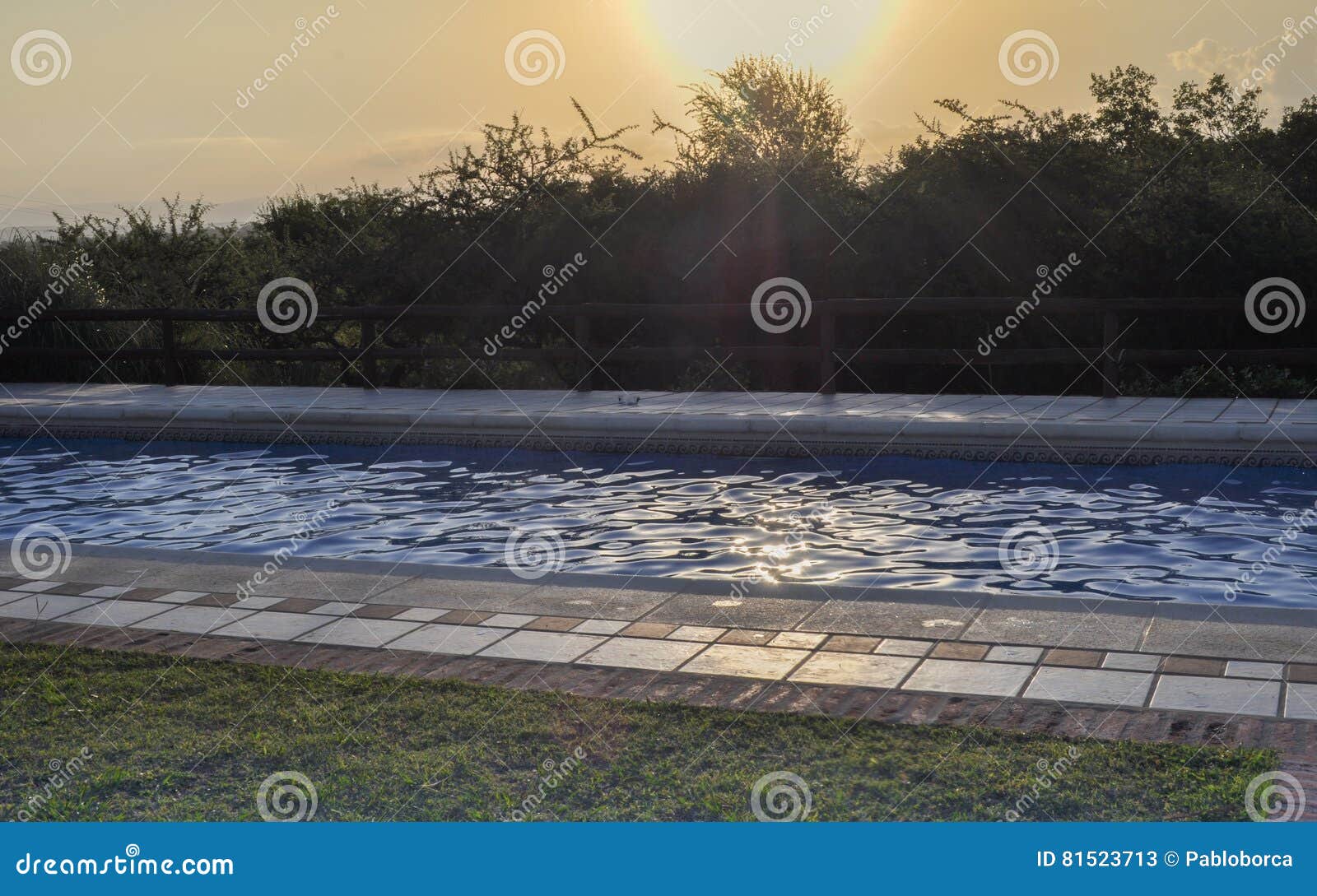 Swimming pool in sunrise stock image. Image of hotel - 81523713