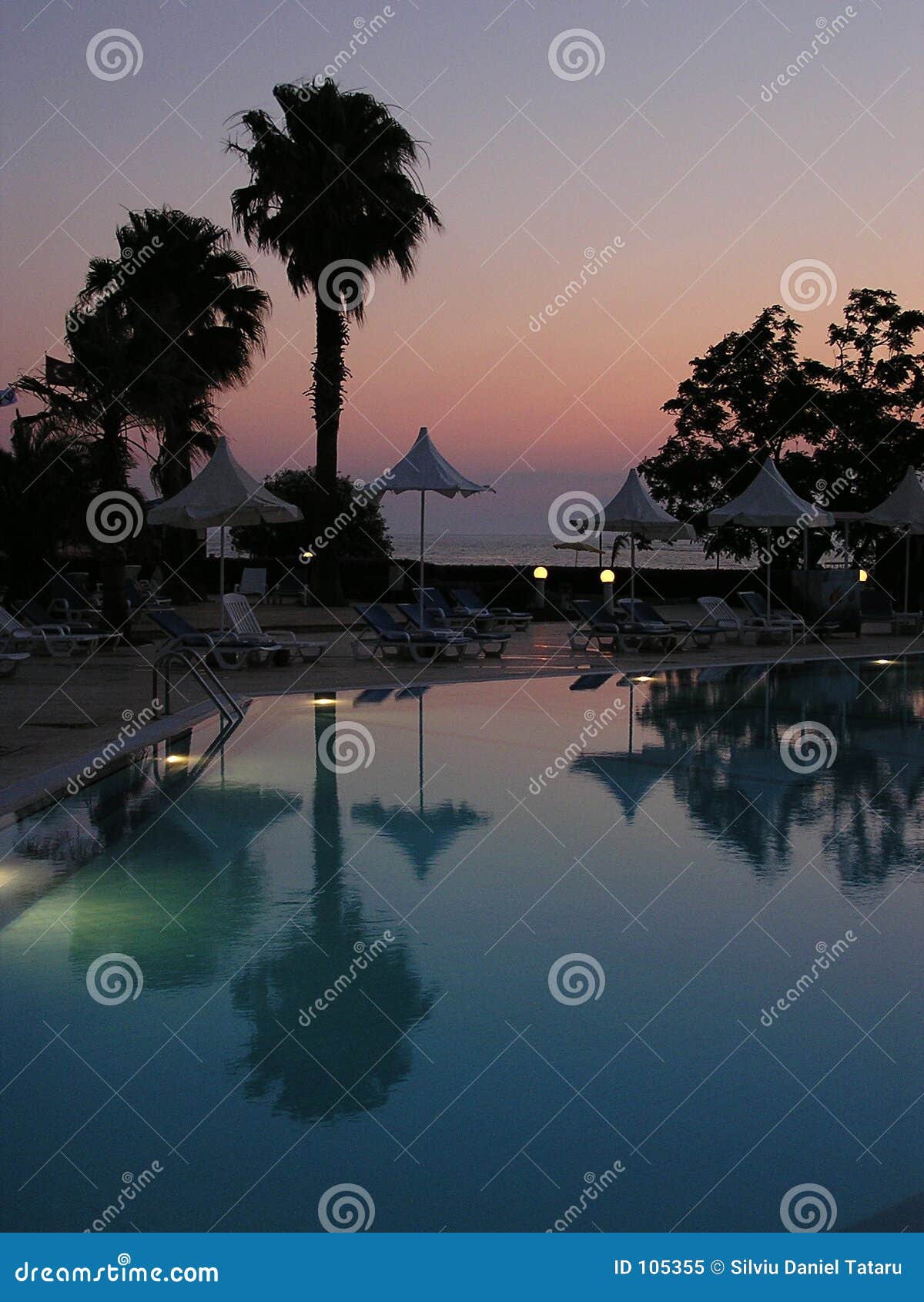 Swimming pool at sunset stock image. Image of swimm, asia - 105355