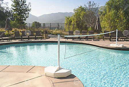 Swimming Pool with Volleyball Net Stock Photo - Image of color, curved ...