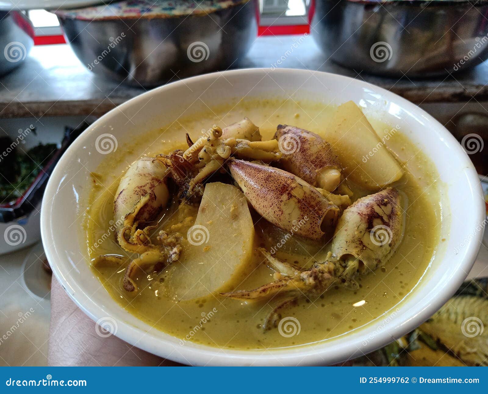 Swimming Squid in a Potato Cube Stock Photo - Image of cuisine, meal ...