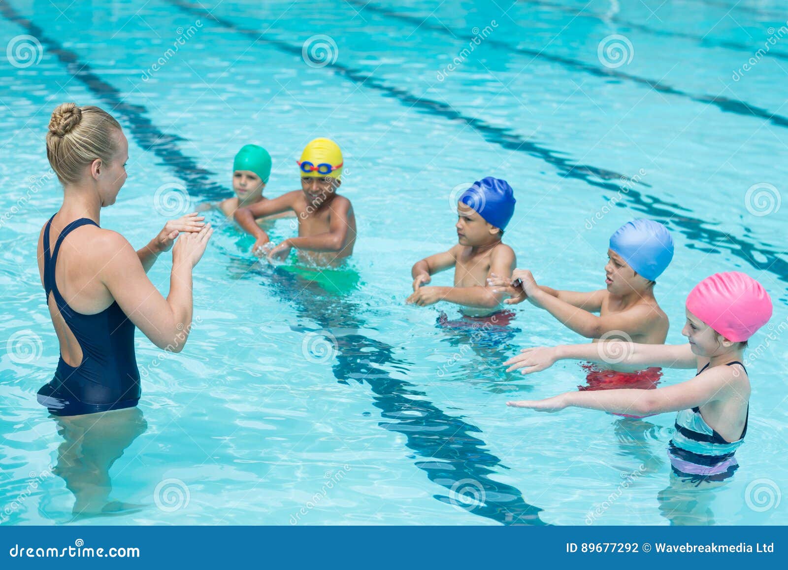 Swimming Trainer Instructing Students Stock Photo - Image of shirtless ...