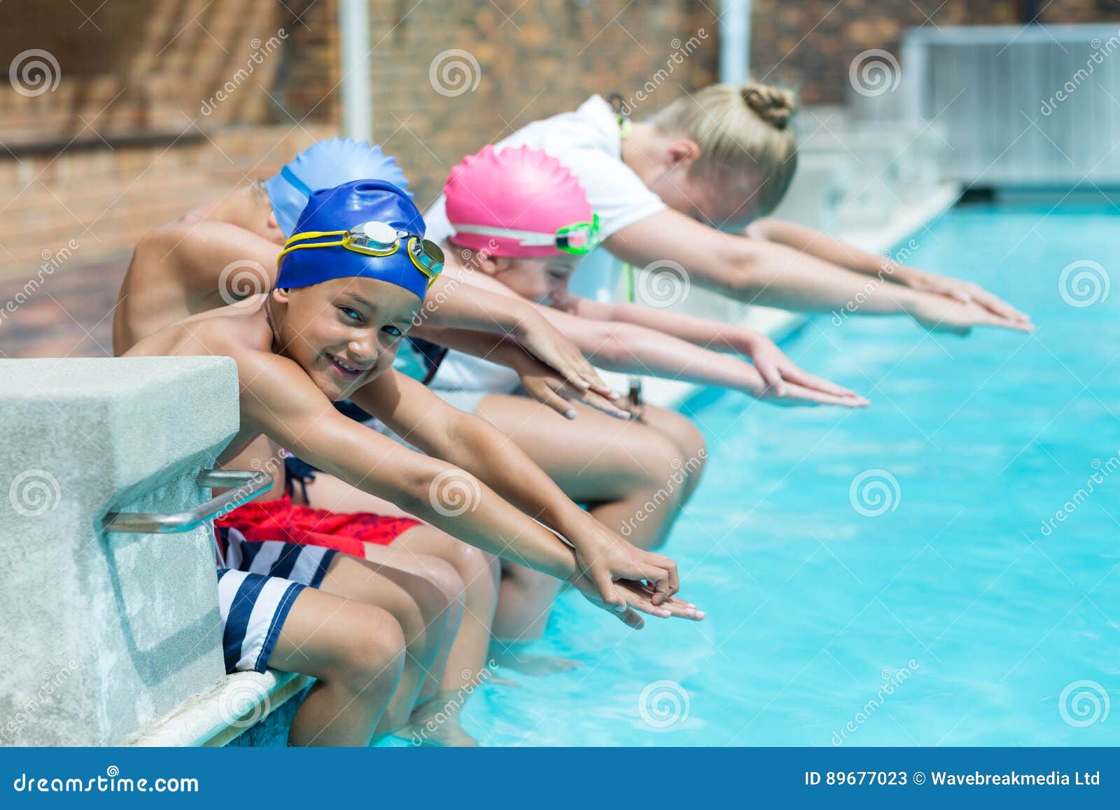 Swimming Trainer Teaching Children at Pool Side Stock Image - Image of ...