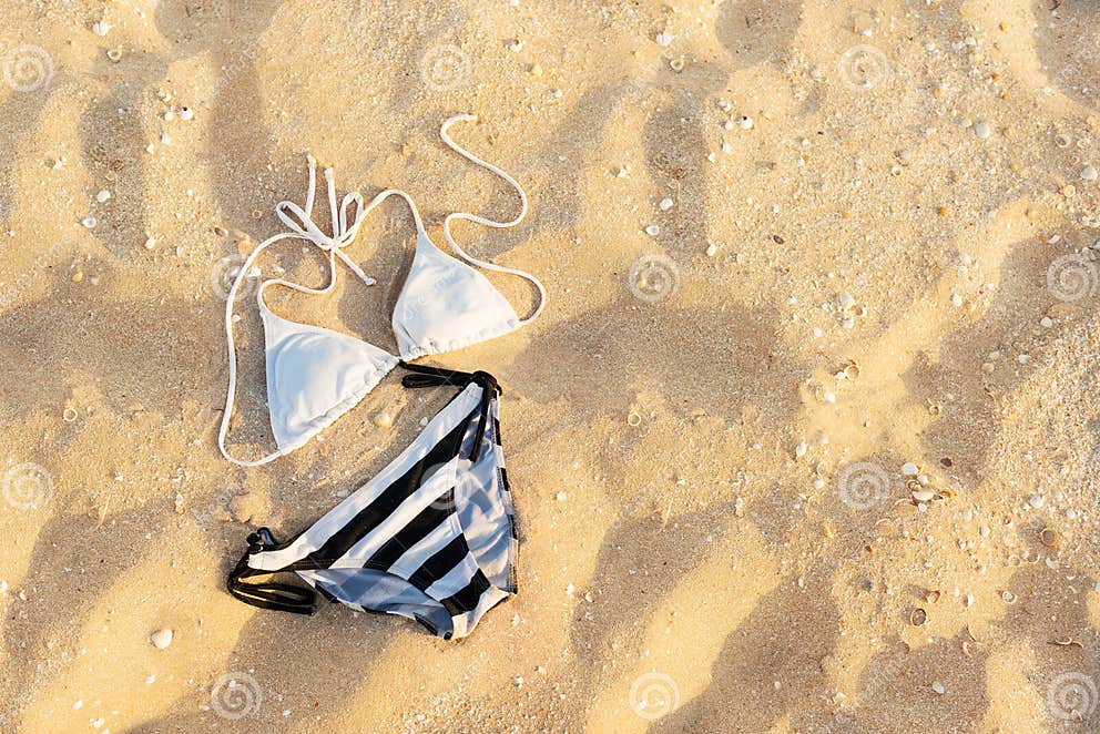 Swimsuit in the sand stock photo. Image of holiday, dress - 33875306