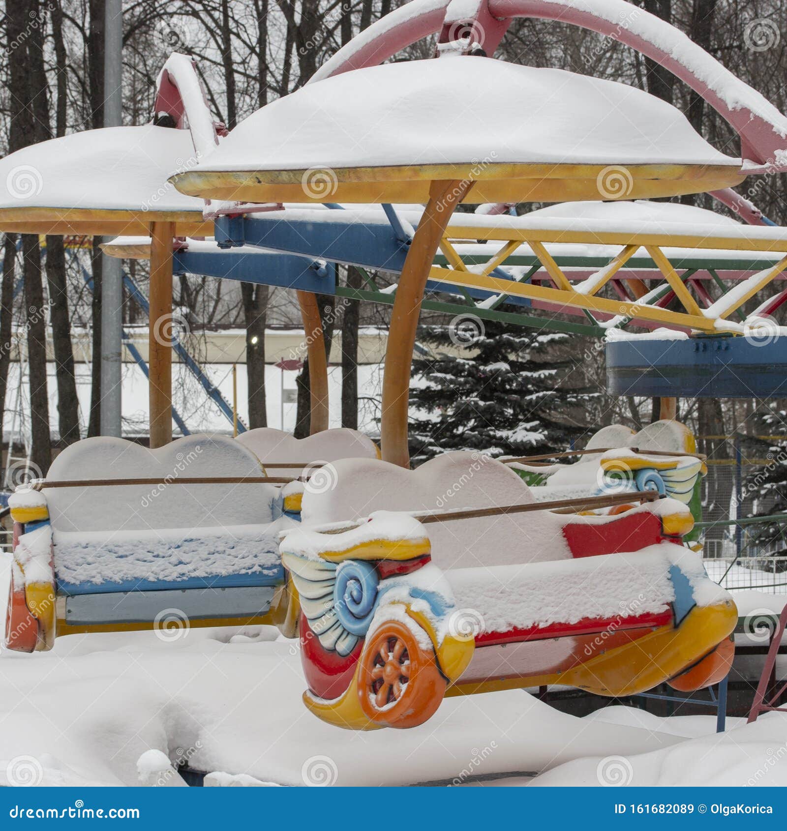 Swing Carousel Seat in the Snow, Bright Multi-colored Attraction Under ...