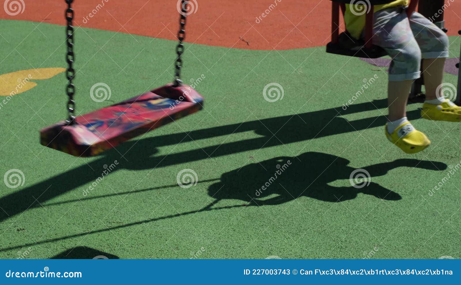 Swing and Child, Full and Empty Swing in the Playground, Sunlight and ...