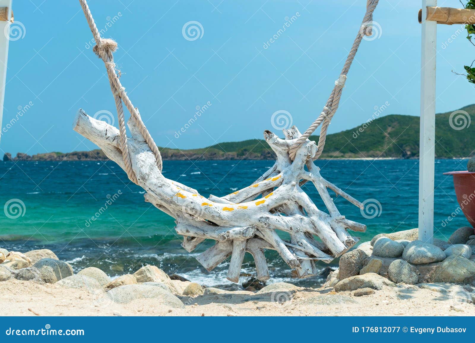 Swing in the Form of a Branch on a White Rope and the Sea in the ...
