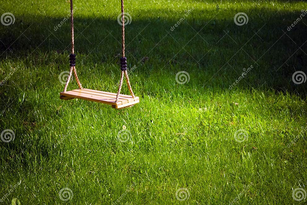 Swing in a garden stock photo. Image of outdoors, grass - 15562854