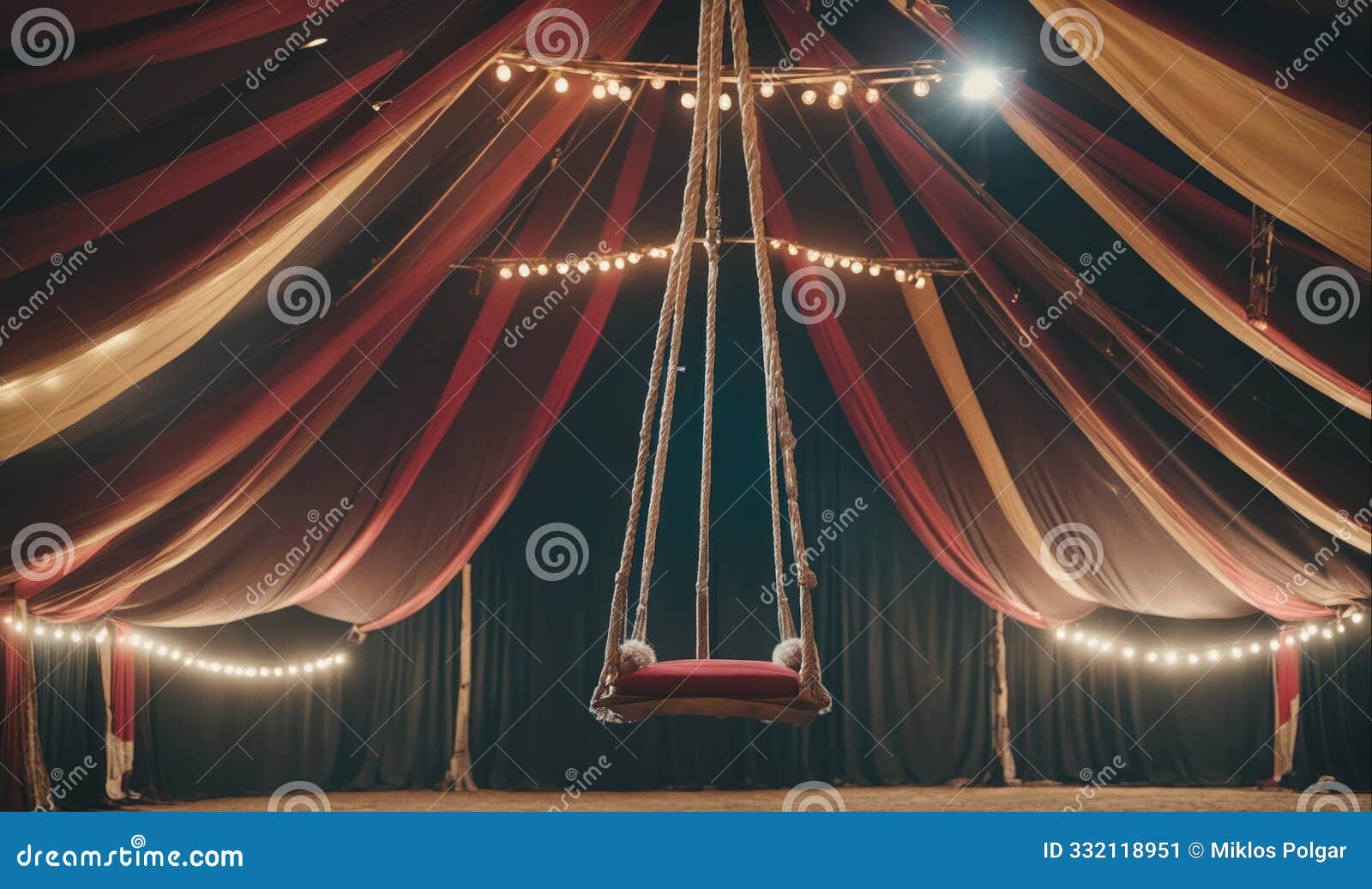 A Swing Hangs from the Ceiling of a Large Circus Tent, Illuminated by ...