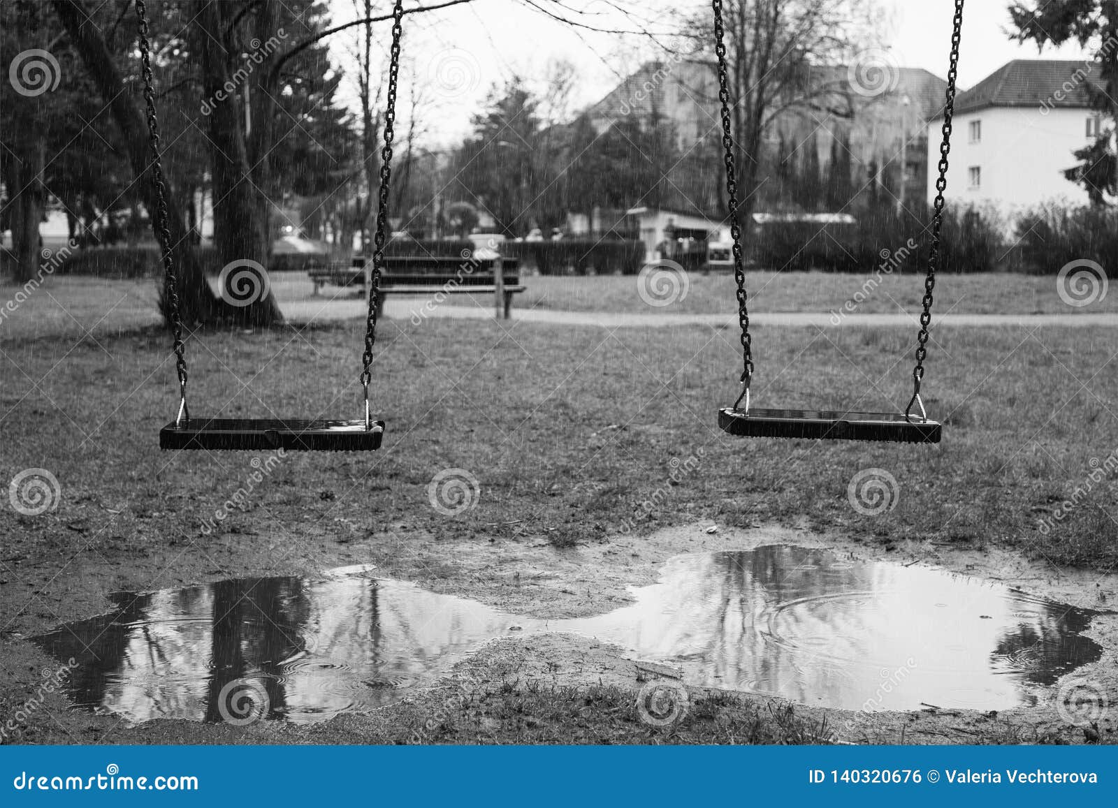 Swing on Playground Covered by Rain during Rainy Day. Stock Photo ...
