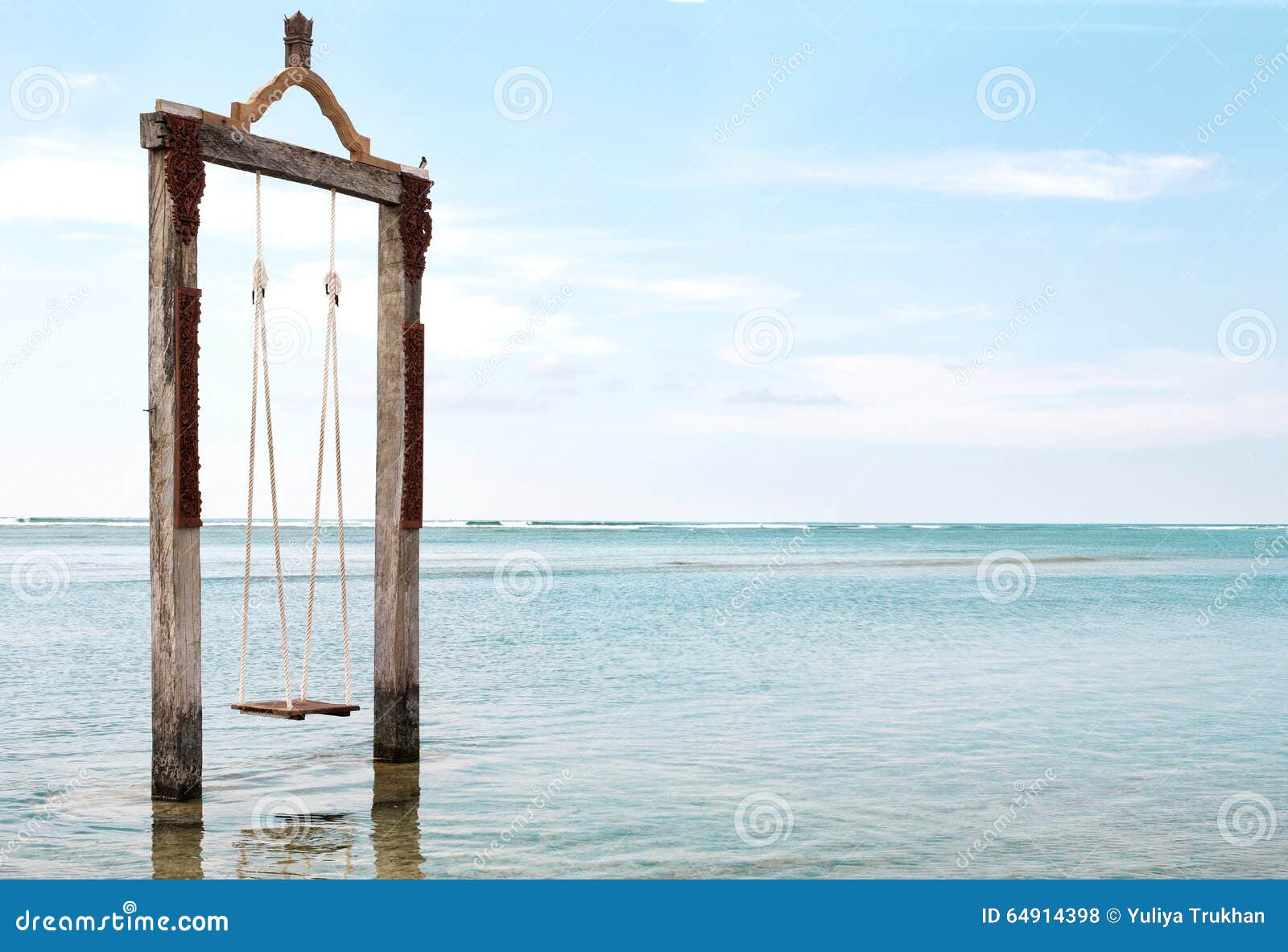 Swing in the sea stock photo. Image of beach, serene - 64914398